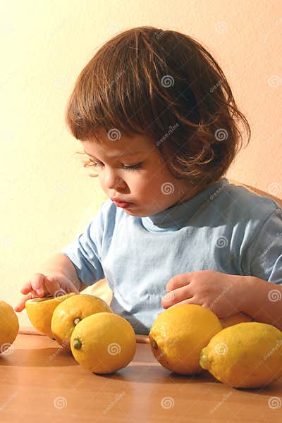 Child and lemons stock photo. Image of little, fruit, tasty - 2060946