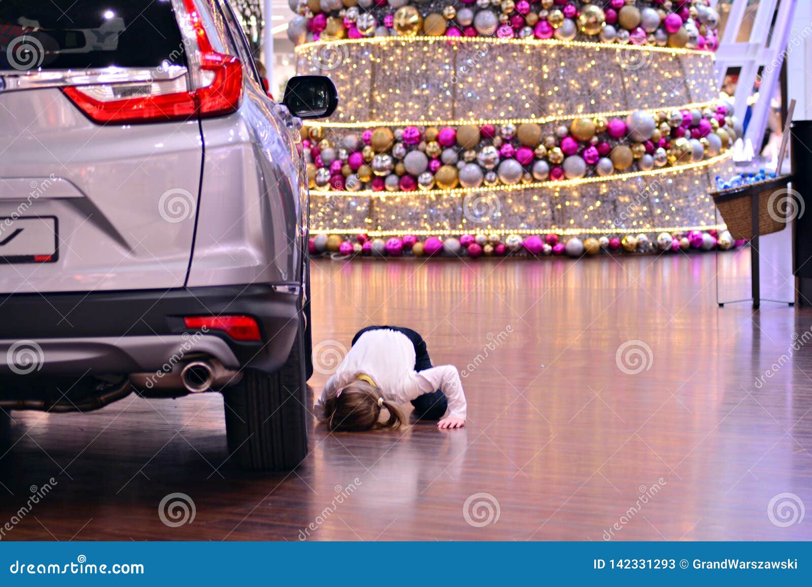 Child Looking For Something Under The Car Stock Image - Image of ...