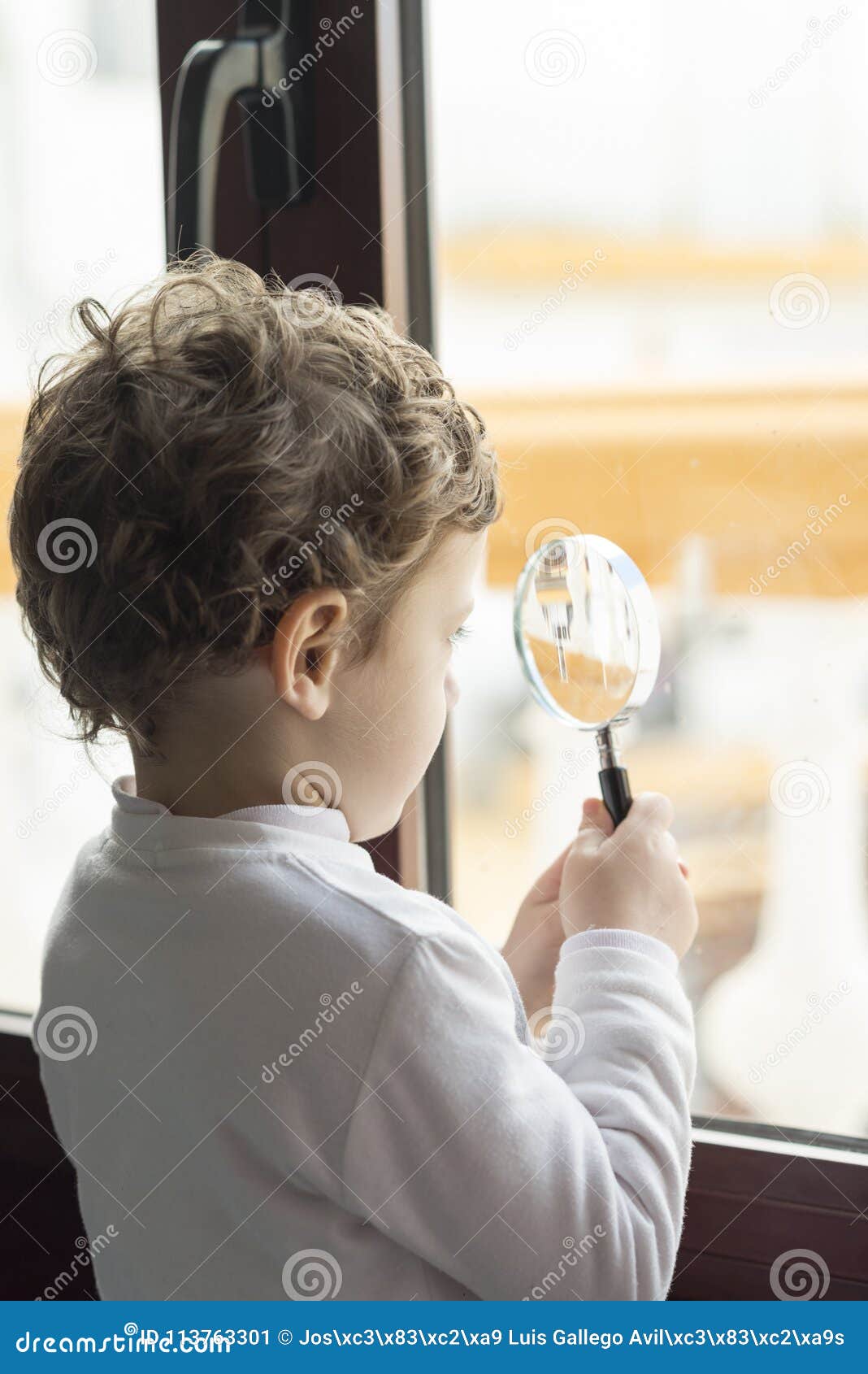 Child Looking through a Window through a Magnifying Glass Stock Image ...