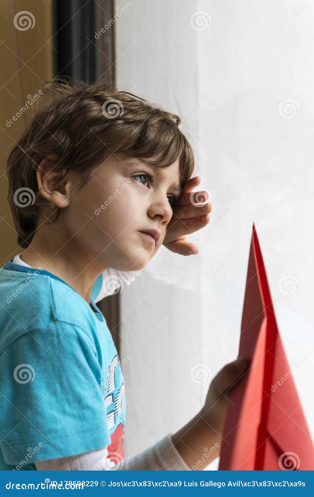 Child Looking through a Window with a Paper Plane Stock Image - Image ...