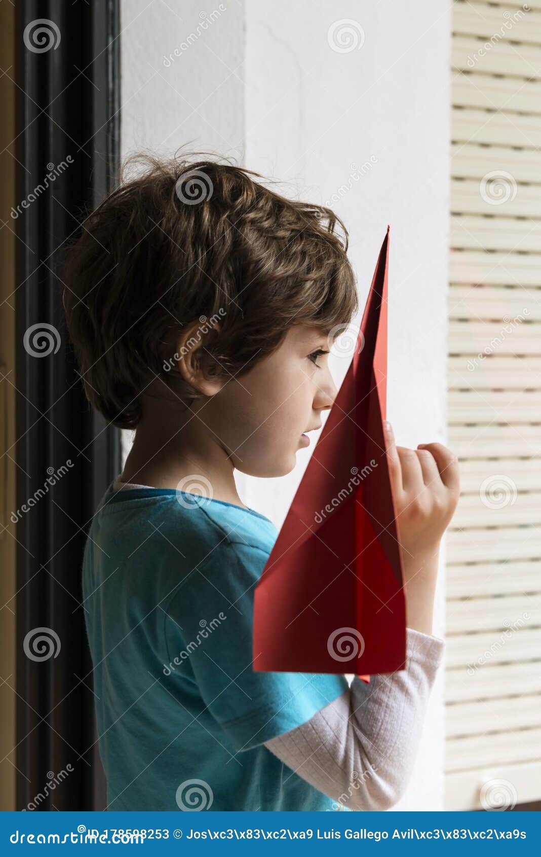 Child Looking through a Window with a Paper Plane Stock Image - Image ...
