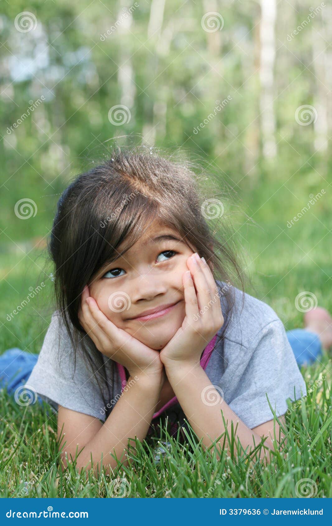Child Lying on Grass Smiling Stock Photo - Image of serene, healthy ...