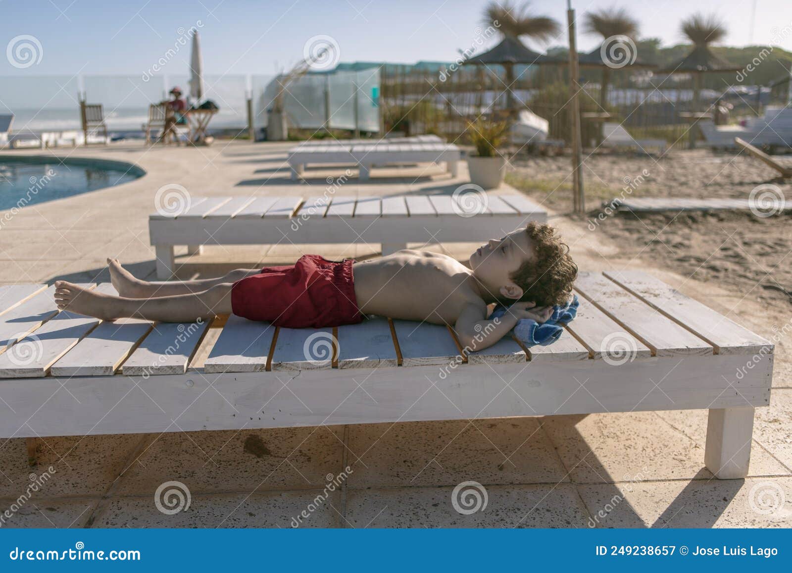 Child Sunbathing Lying on a Pool Lounger Stock Image - Image of eyes ...