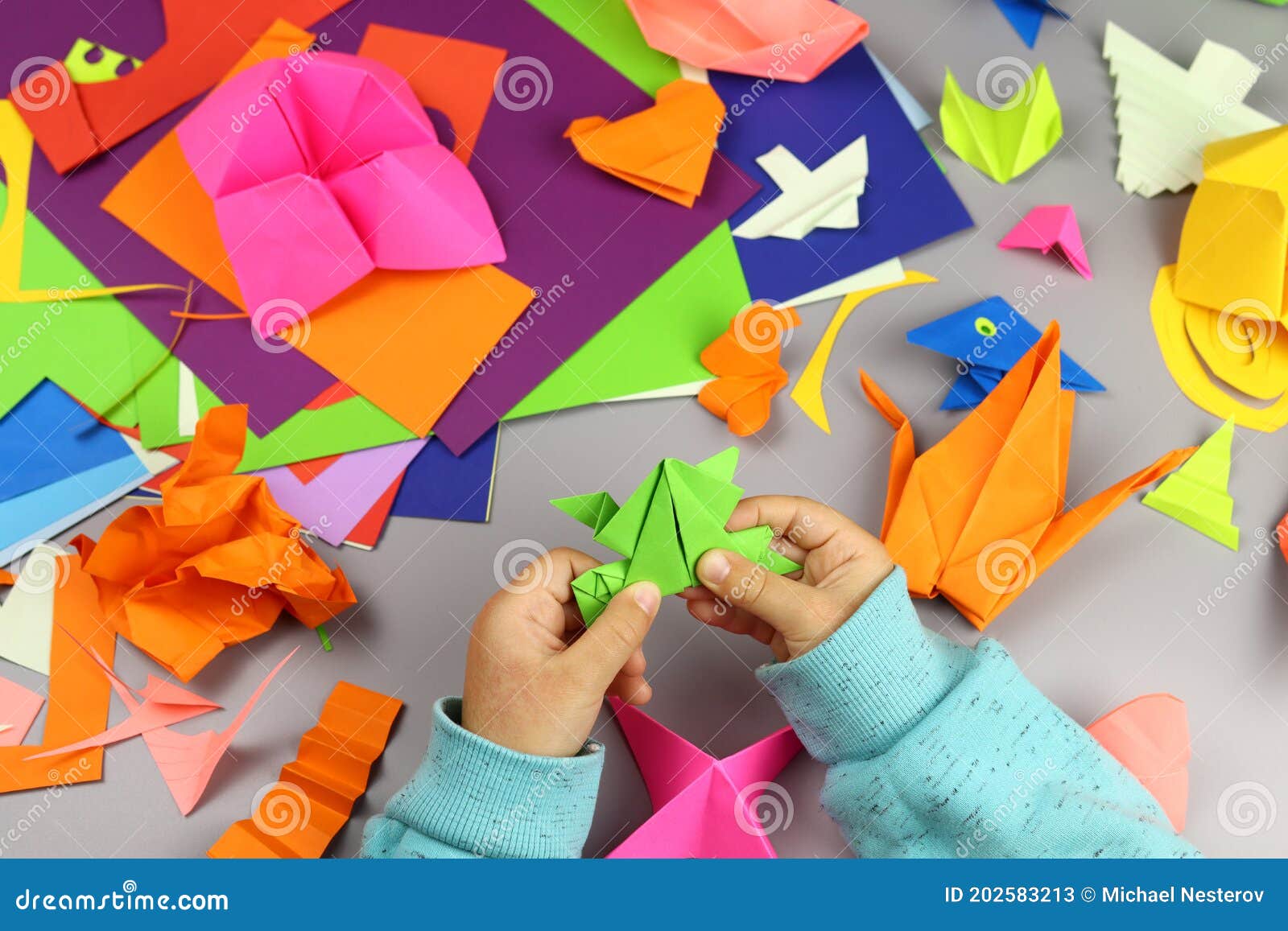Child Makes Origami Crafts from Colored Paper Stock Image - Image of ...