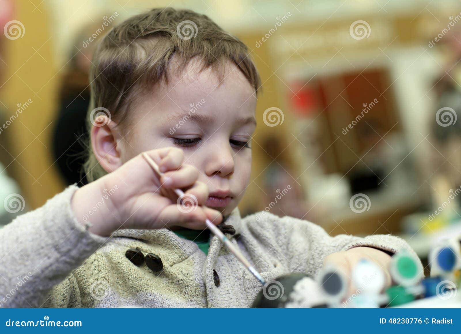Child making cardboard toy stock photo. Image of male - 48230776