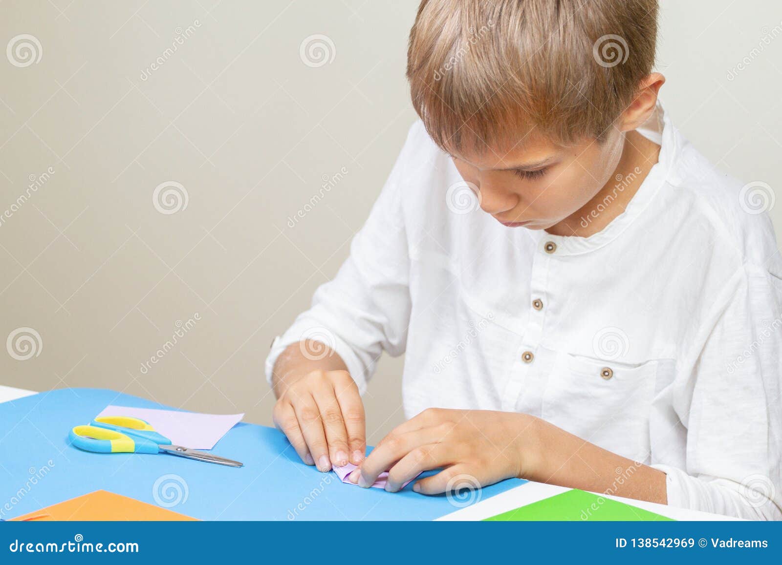 Child Making Greeting Card with Colored Paper at the Table Stock Image ...