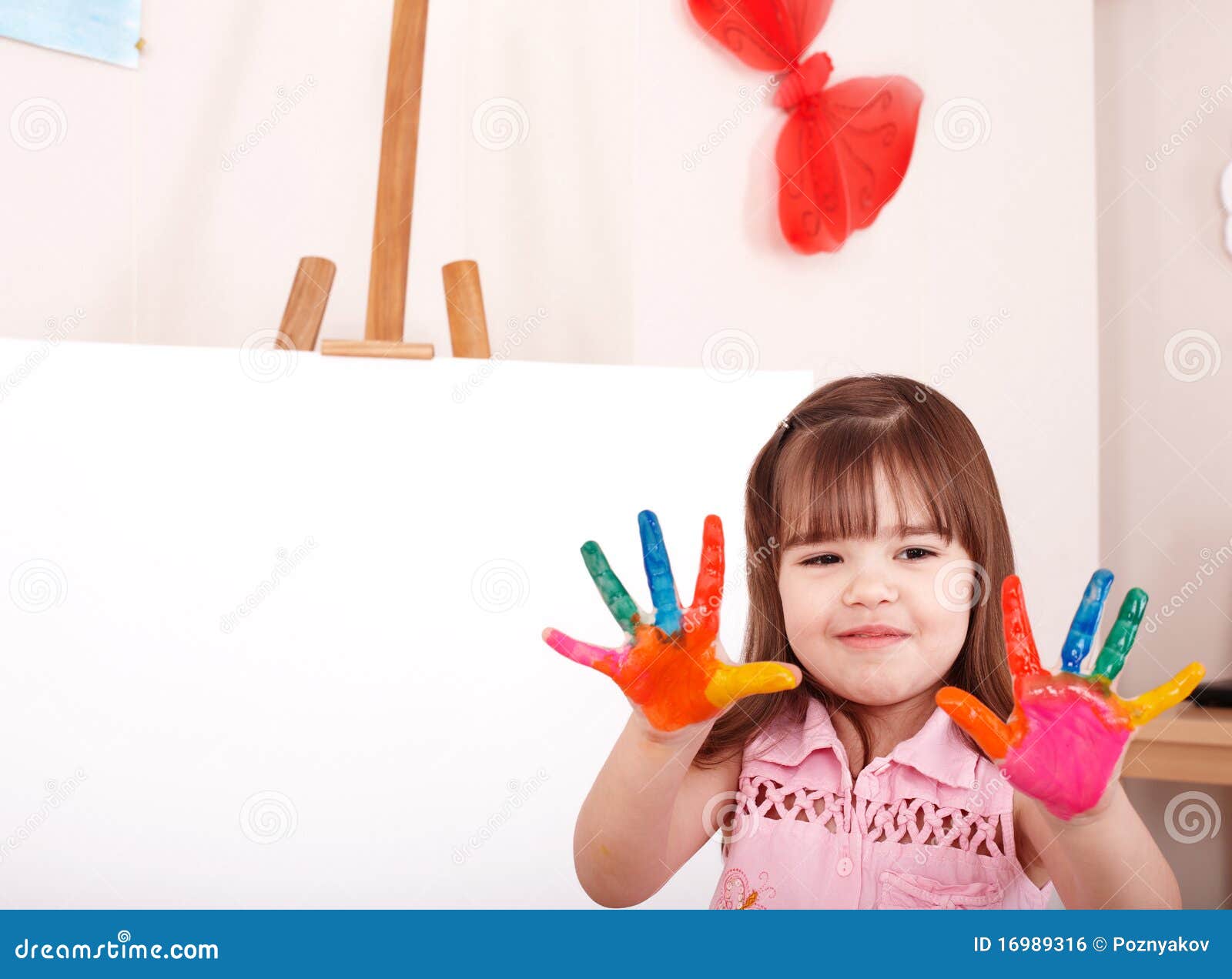 Child making hand prints. stock photo. Image of artist - 16989316