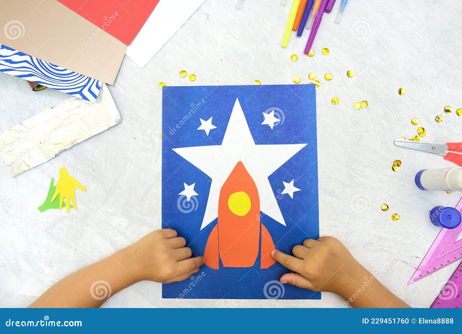 Child Making Rocket and Stars from Paper. Creative Children Play with ...