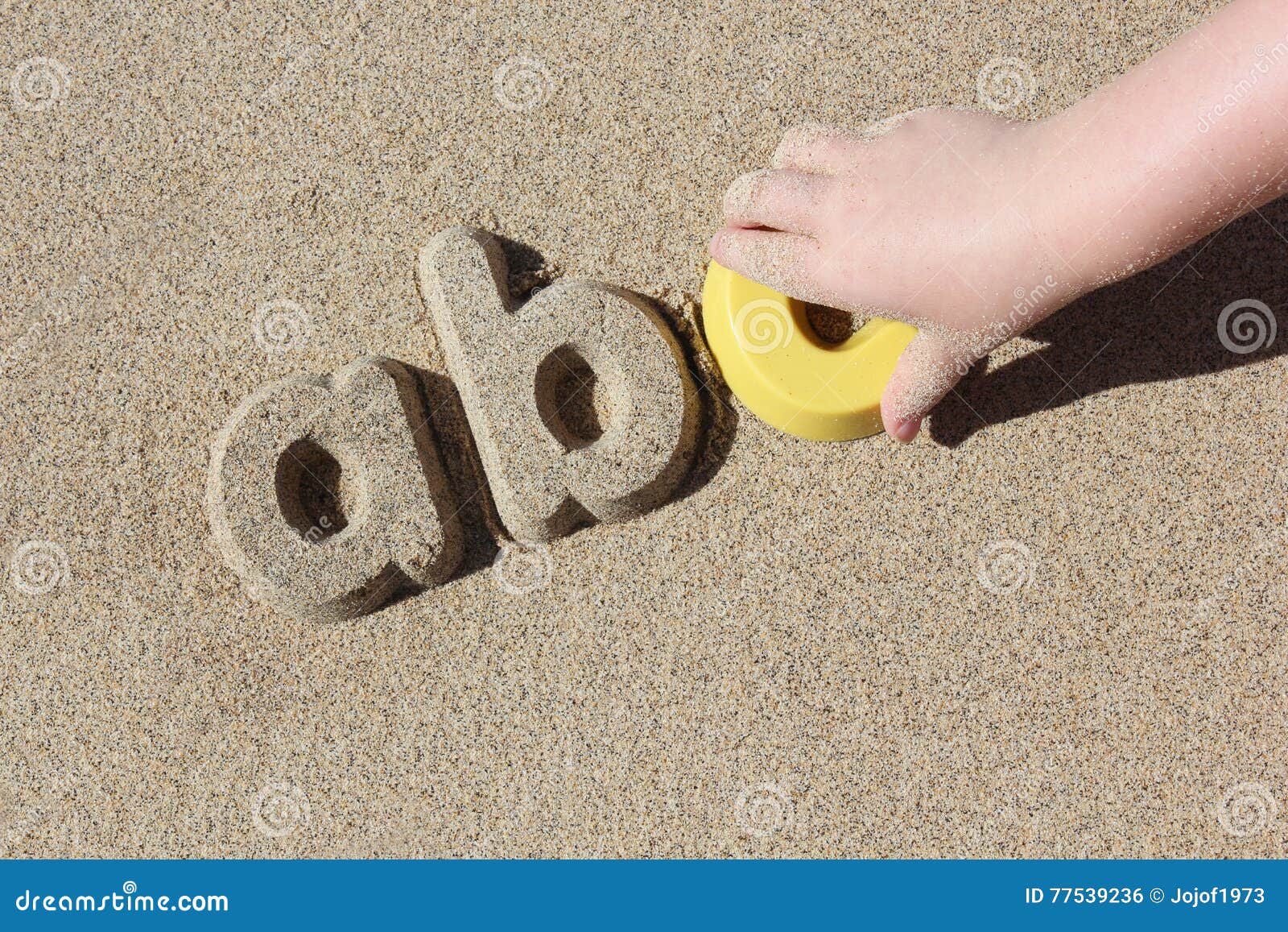 Child Making Sand Letters on the Beach Stock Photo - Image of hand ...
