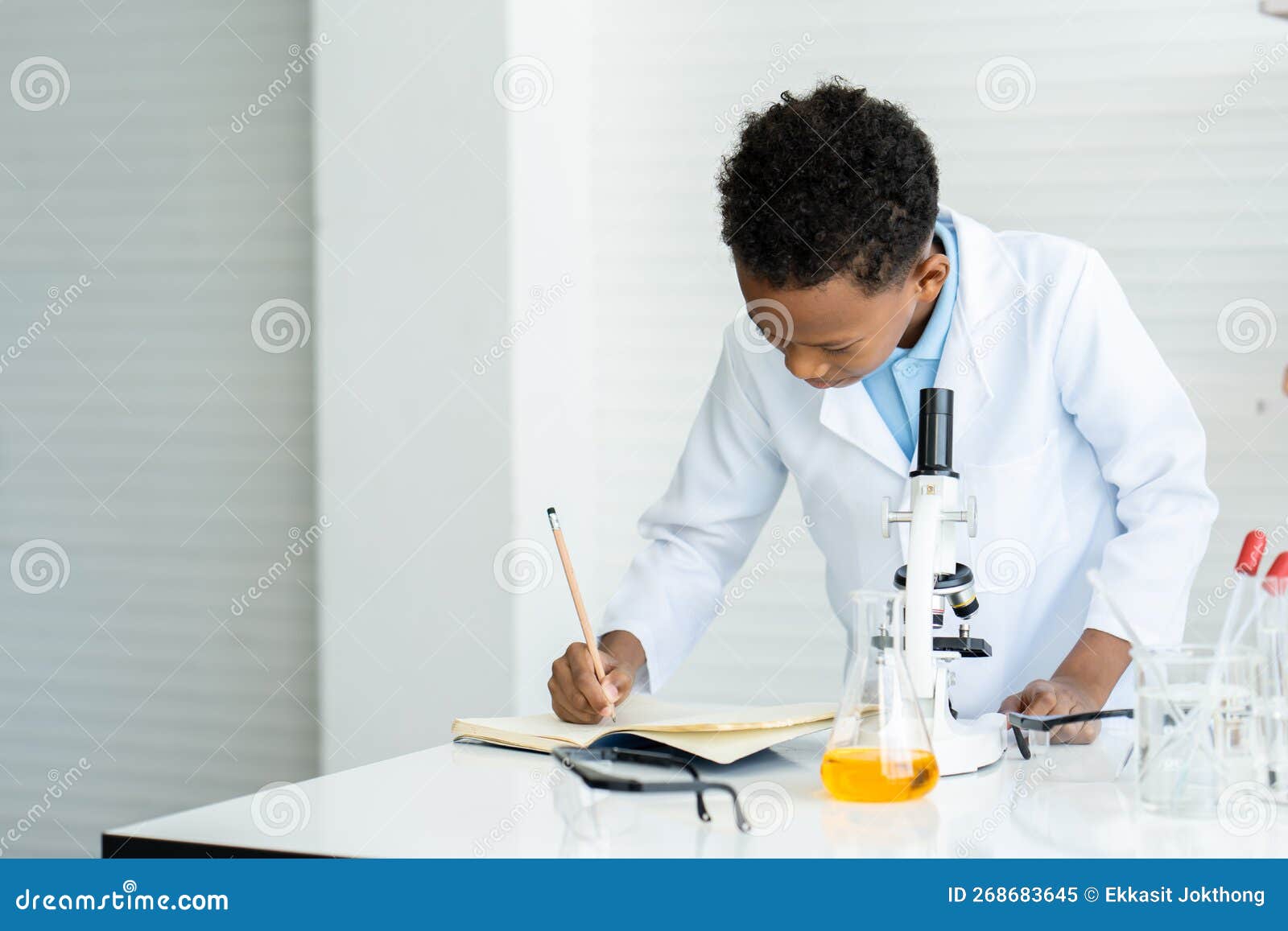 Child Male Student Standing, Using His Eyes, Look Down into Microscope ...