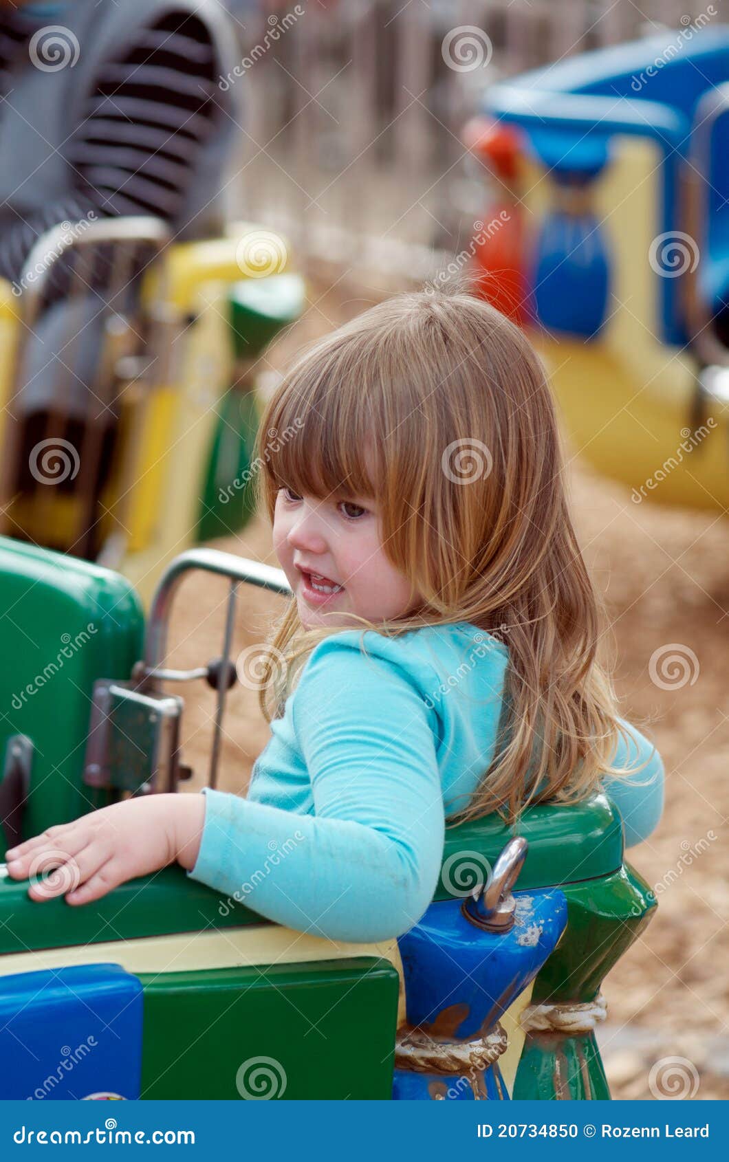 Child on merry go round stock photo. Image of enjoyment - 20734850