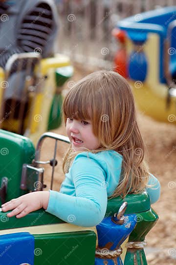 Child on merry go round stock photo. Image of enjoyment - 20734850