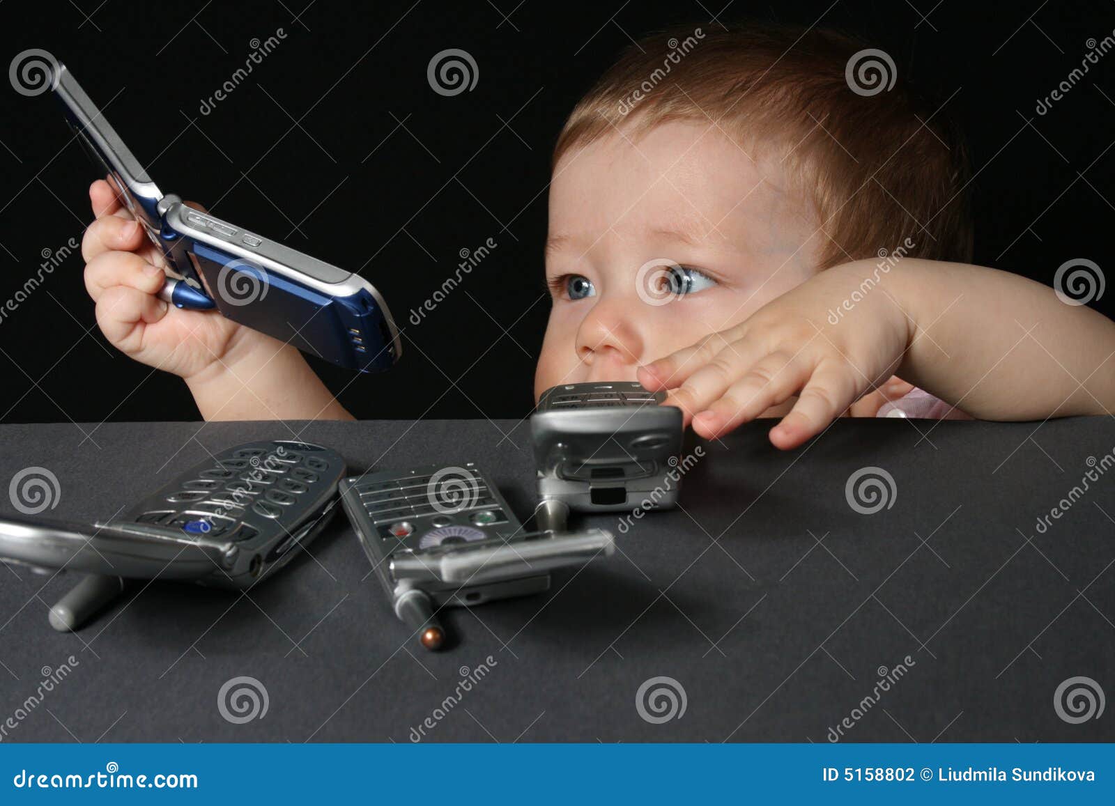 Child with mobile phones stock photo. Image of call, busy - 5158802