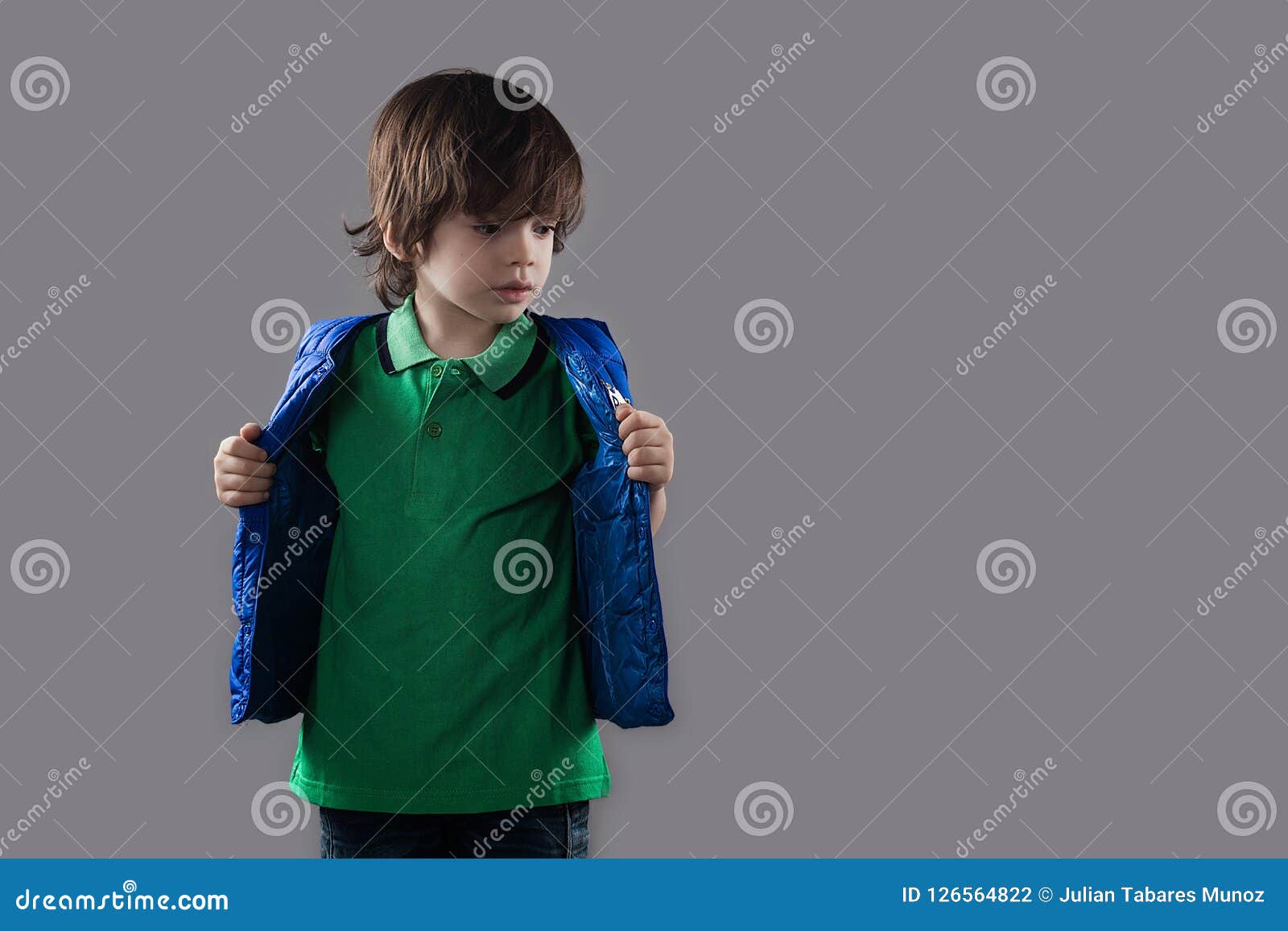 Boy with blue jacket stock photo. Image of background - 126564822