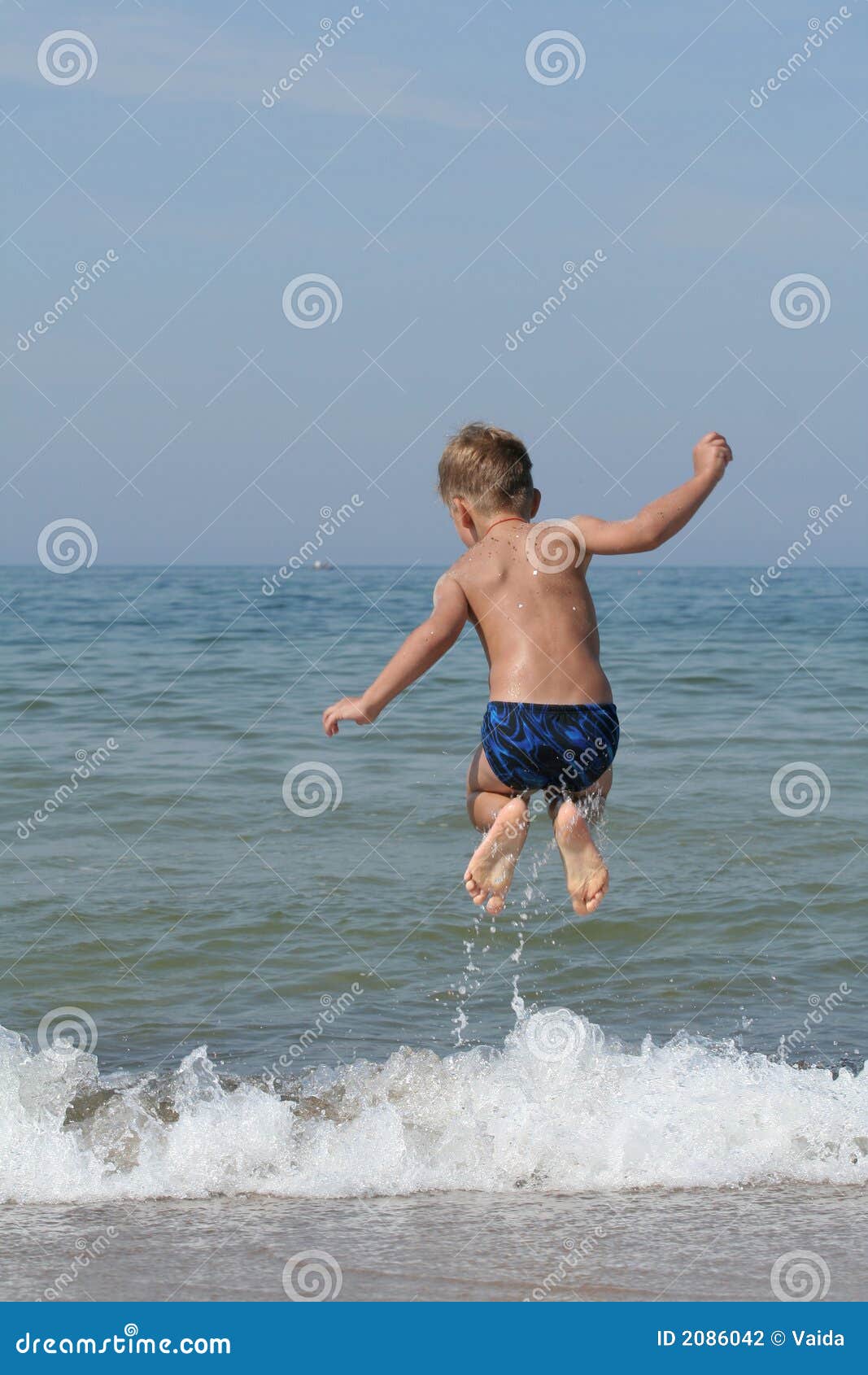 Child in motion stock photo. Image of beach, enjoyable - 2086042