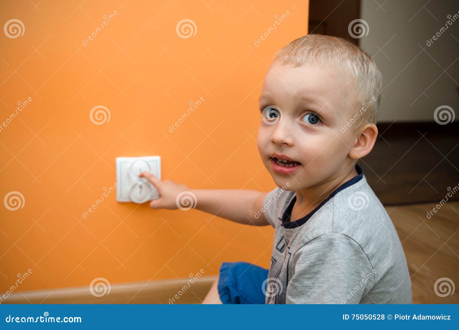 Child Near To the Socket. Electrical Security of Ac Power for Ba Stock ...