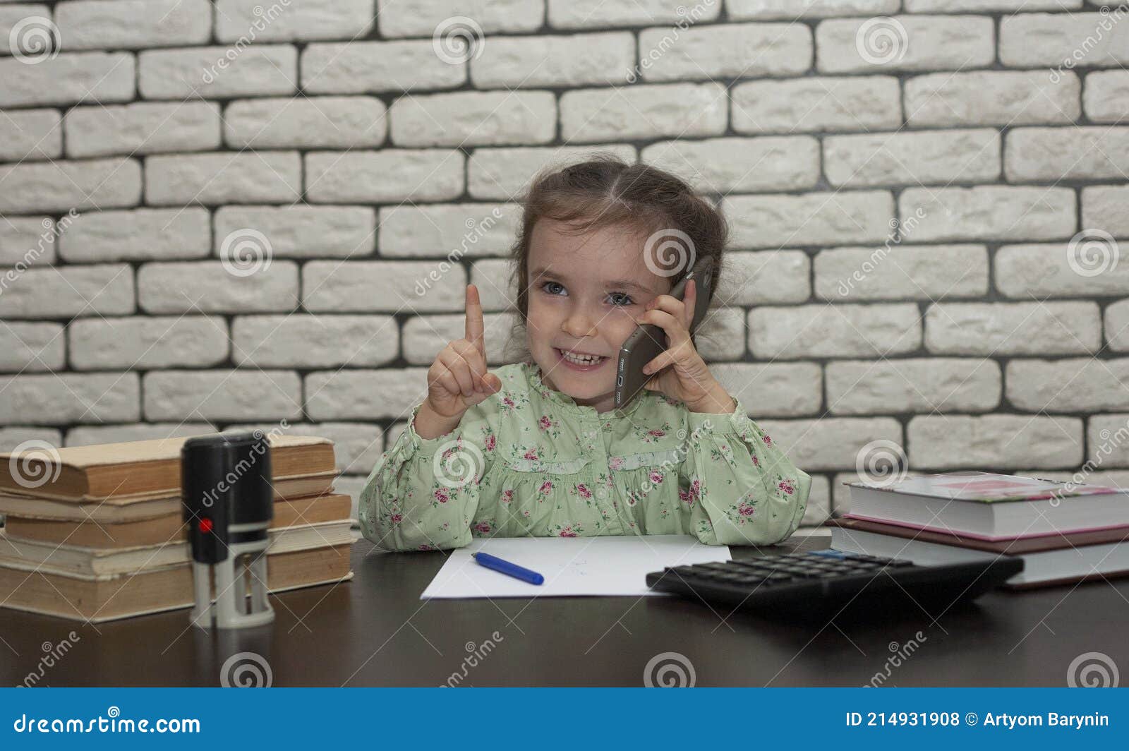 Little Girl Learns Lessons. Knowledge Day. Child in the Office Stock ...