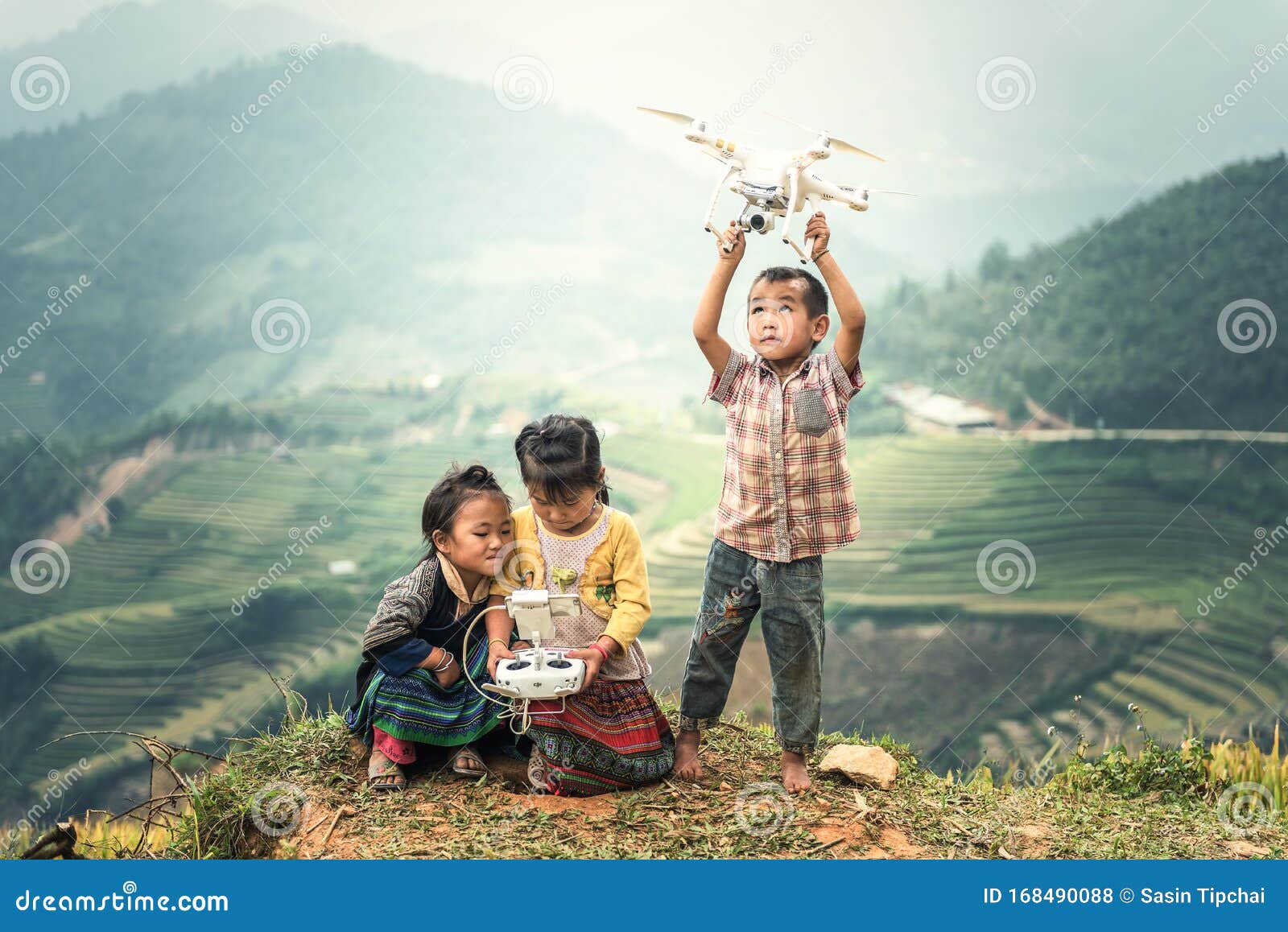Child Operating Drone Flying or Hovering by Remote ControlChild ...