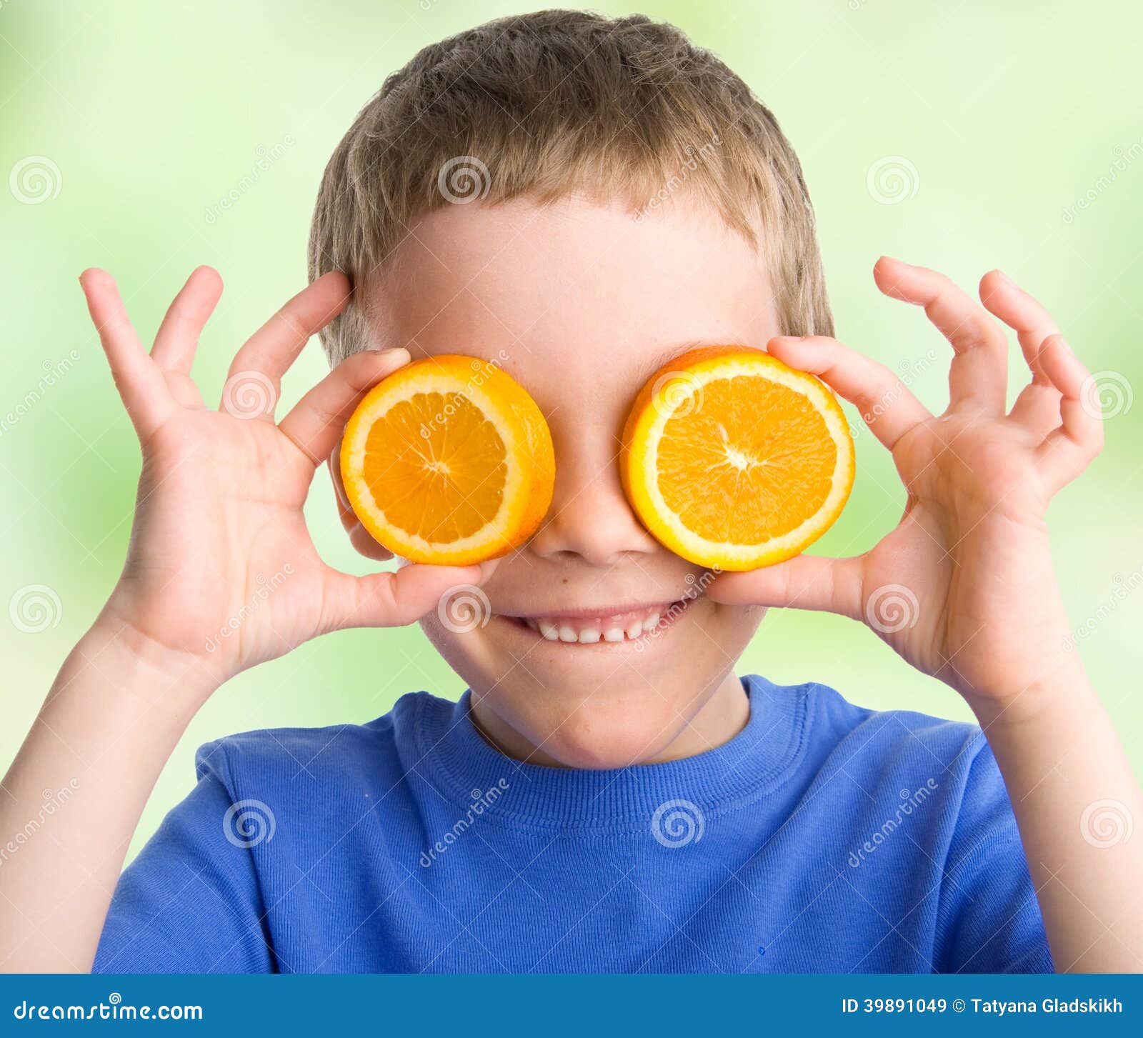 Child with an orange stock image. Image of color, looking - 39891049
