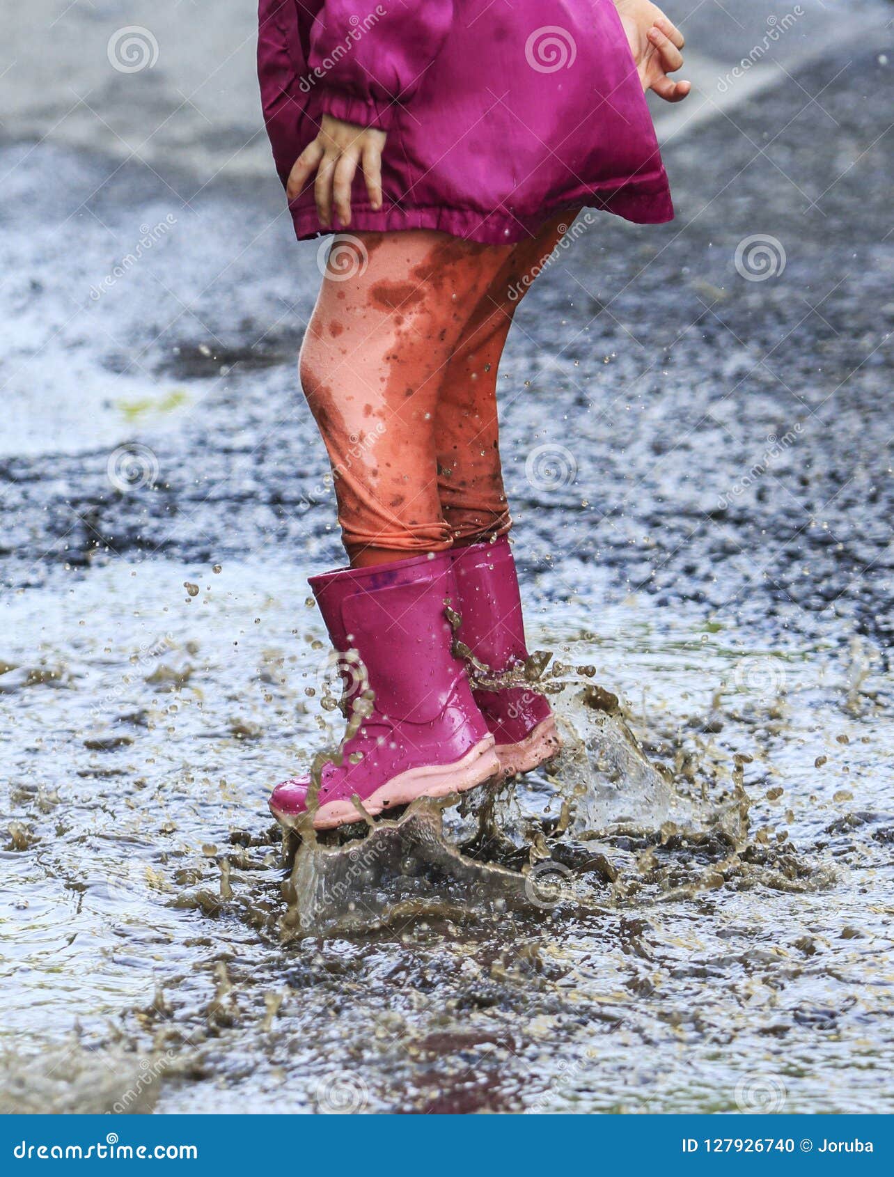 Child Outdoor Jump into Puddle in Boot after Rain Stock Photo - Image ...