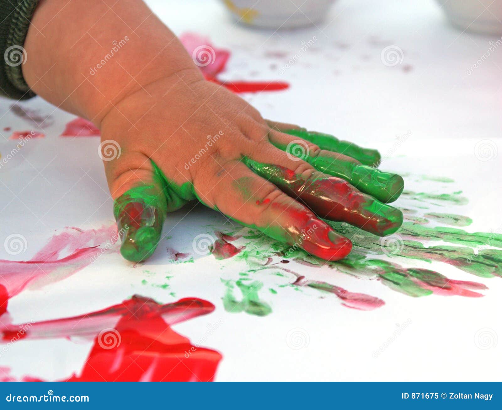 Finger Painting. The Boy Touches Multi-colored Paints With His Fingers ...