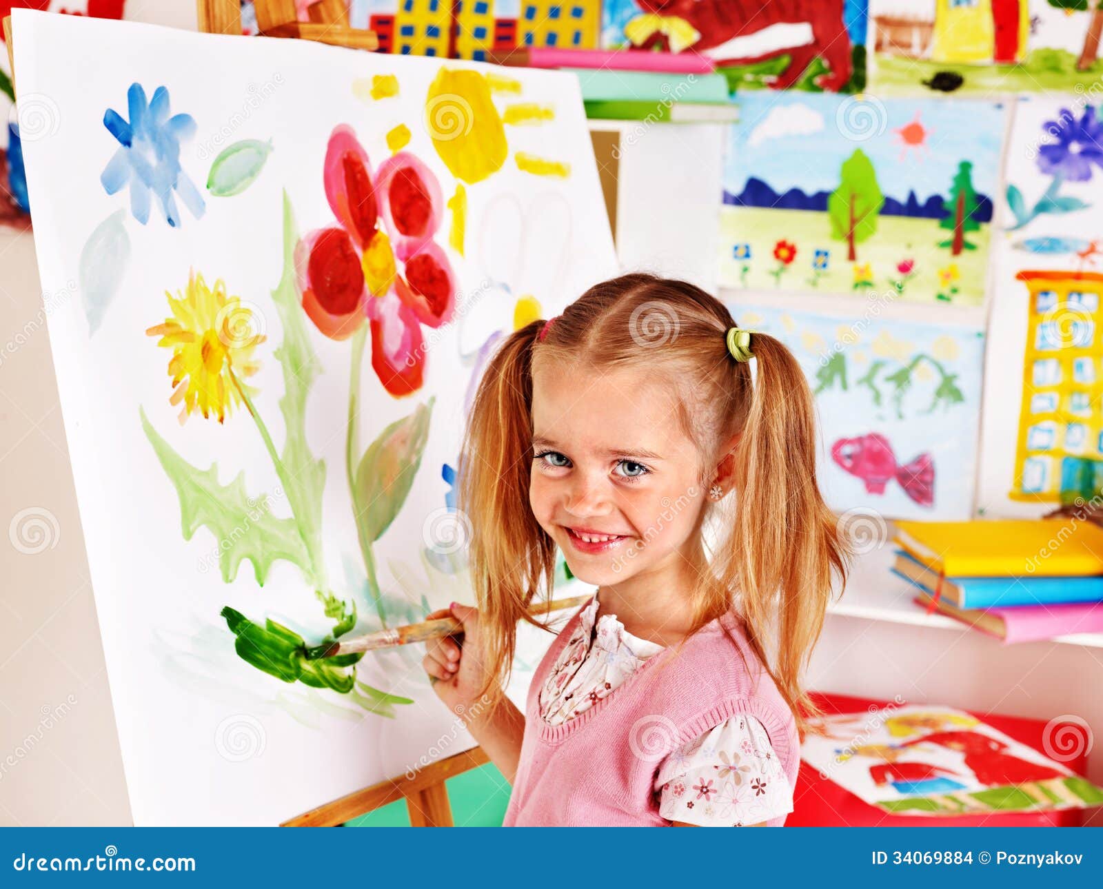 Child painting at easel. stock photo. Image of artistic - 34069884