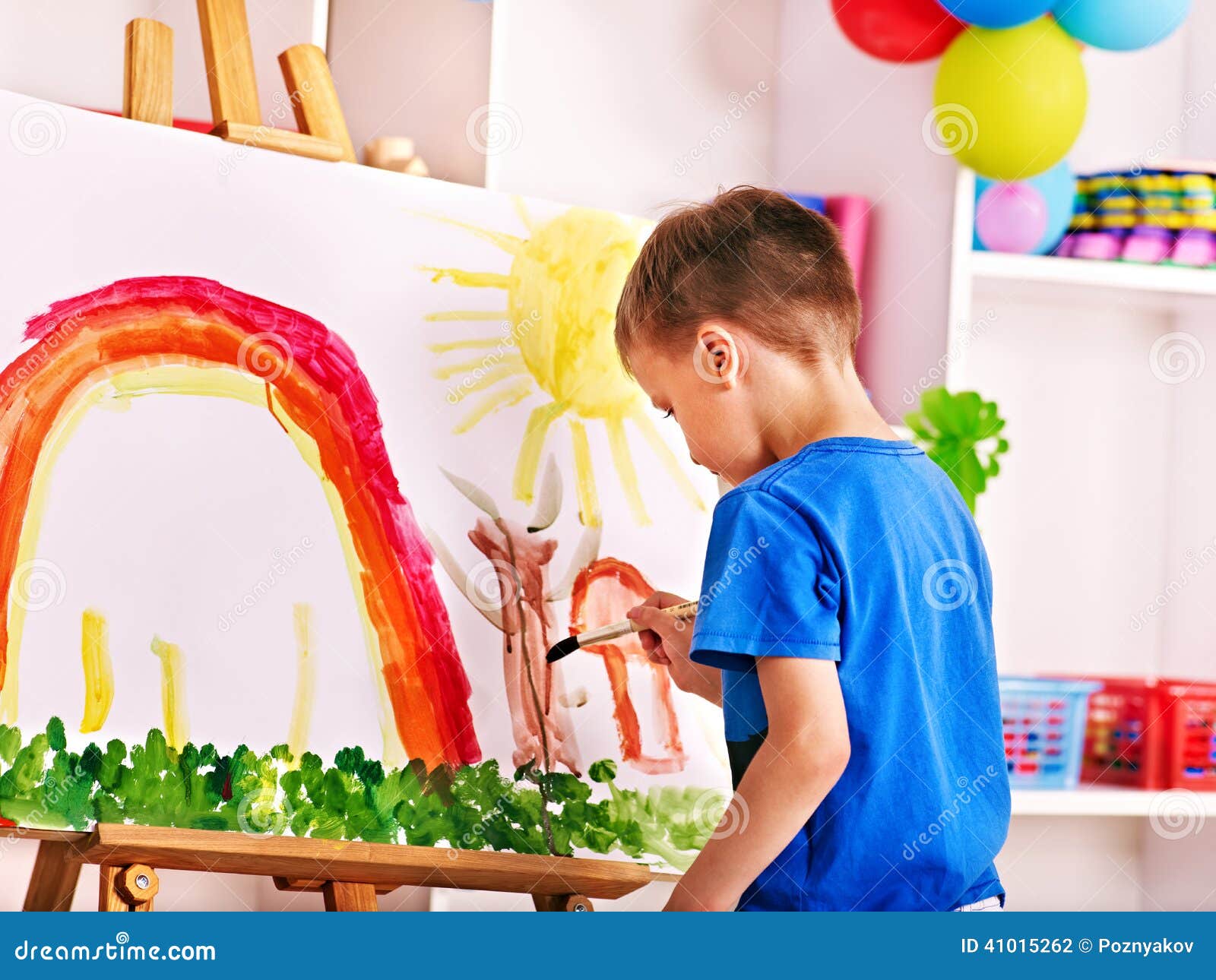Child painting at easel. stock photo. Image of club, childhood - 41015262