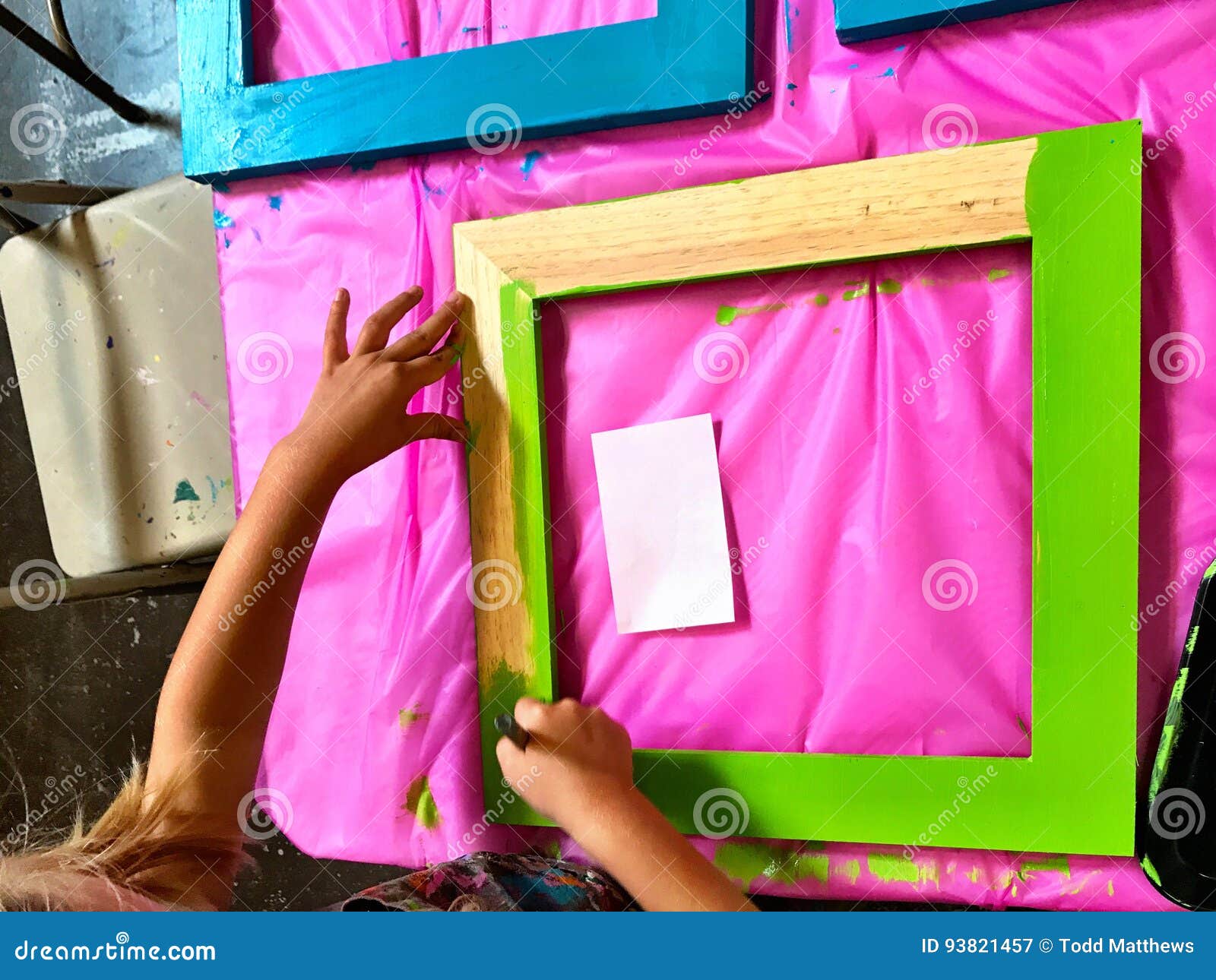 Child painting a frame stock image. Image of painting - 93821457