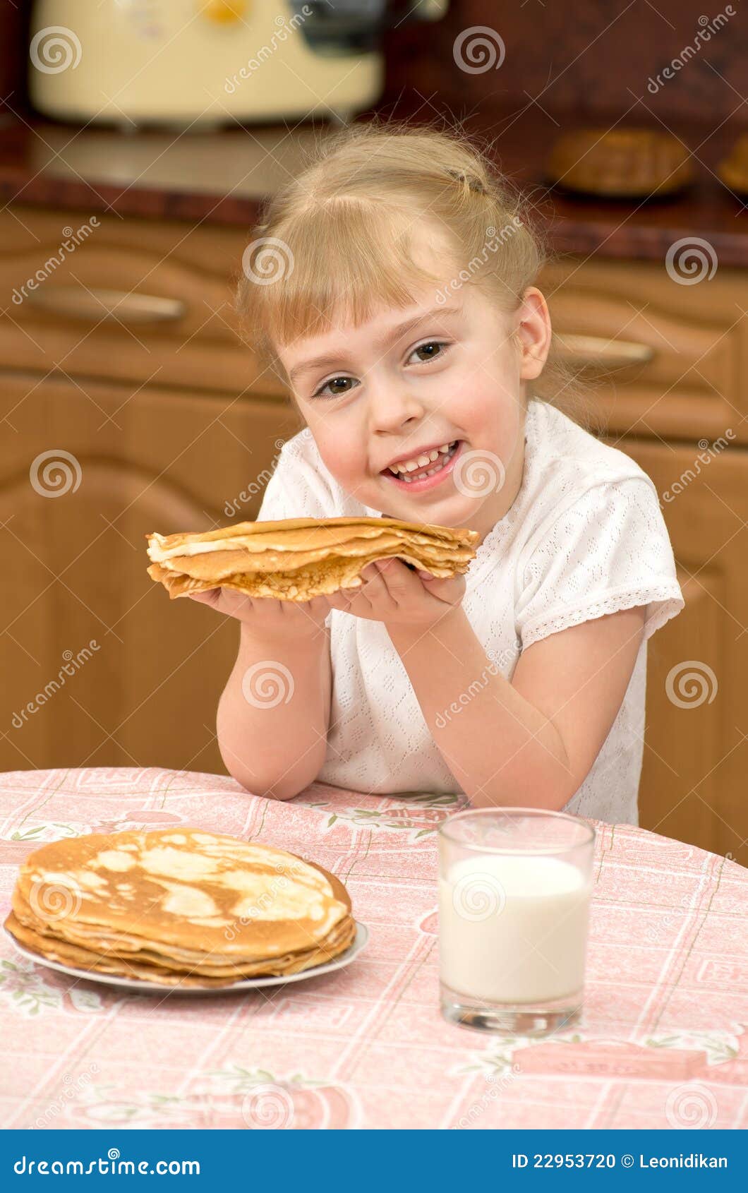 A child with pancakes stock photo. Image of appetite - 22953720