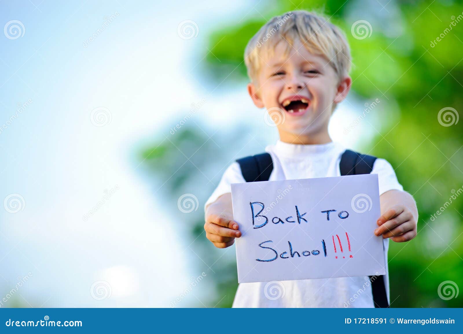 Child with paper sign stock image. Image of smiling, back - 17218591