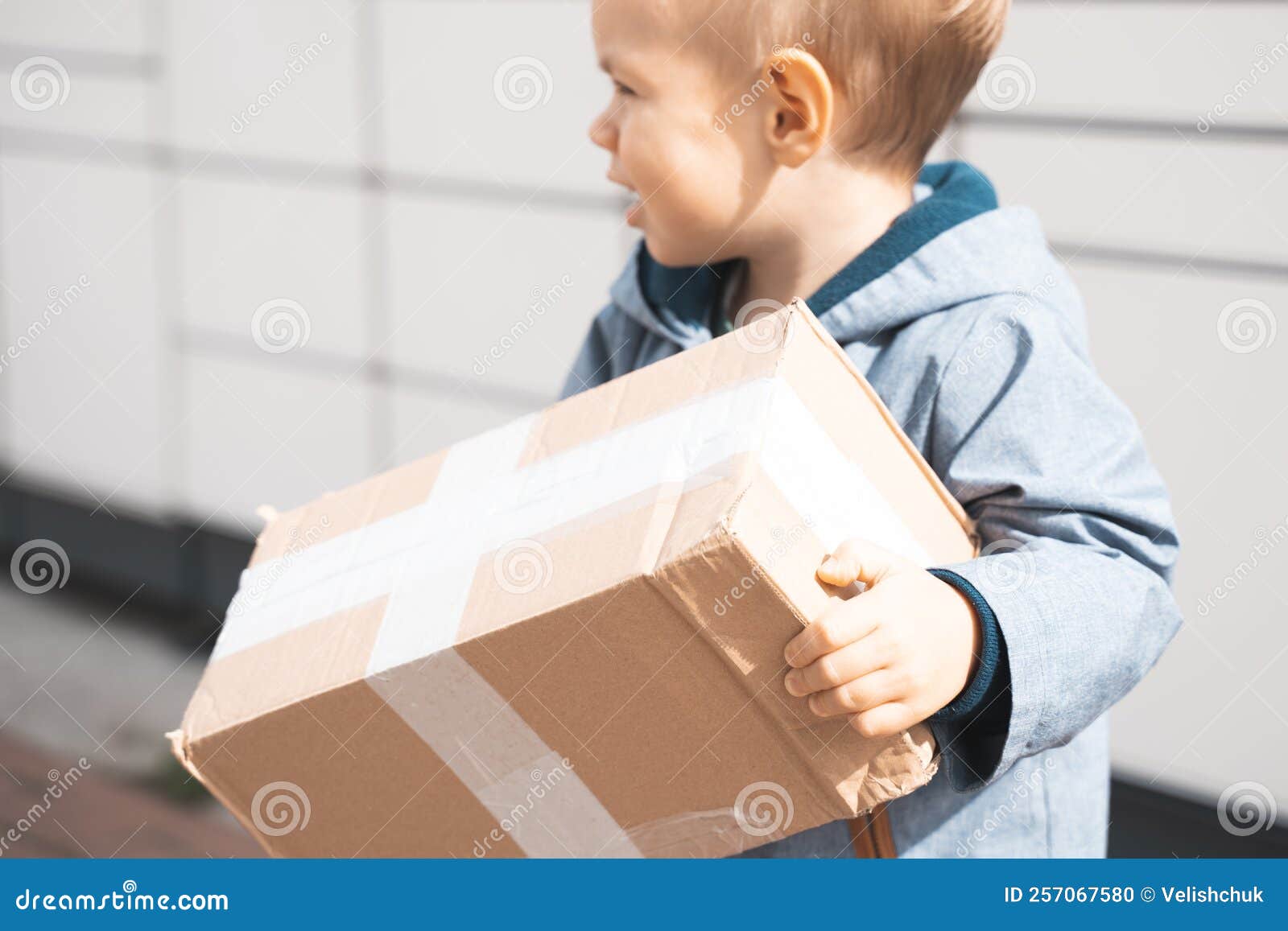 Child Parcel, Boy Using Self Service Parcel Terminal Machine To Send or ... Child Parcel, Boy Using Self Service Parcel Terminal Machine To Send or ...