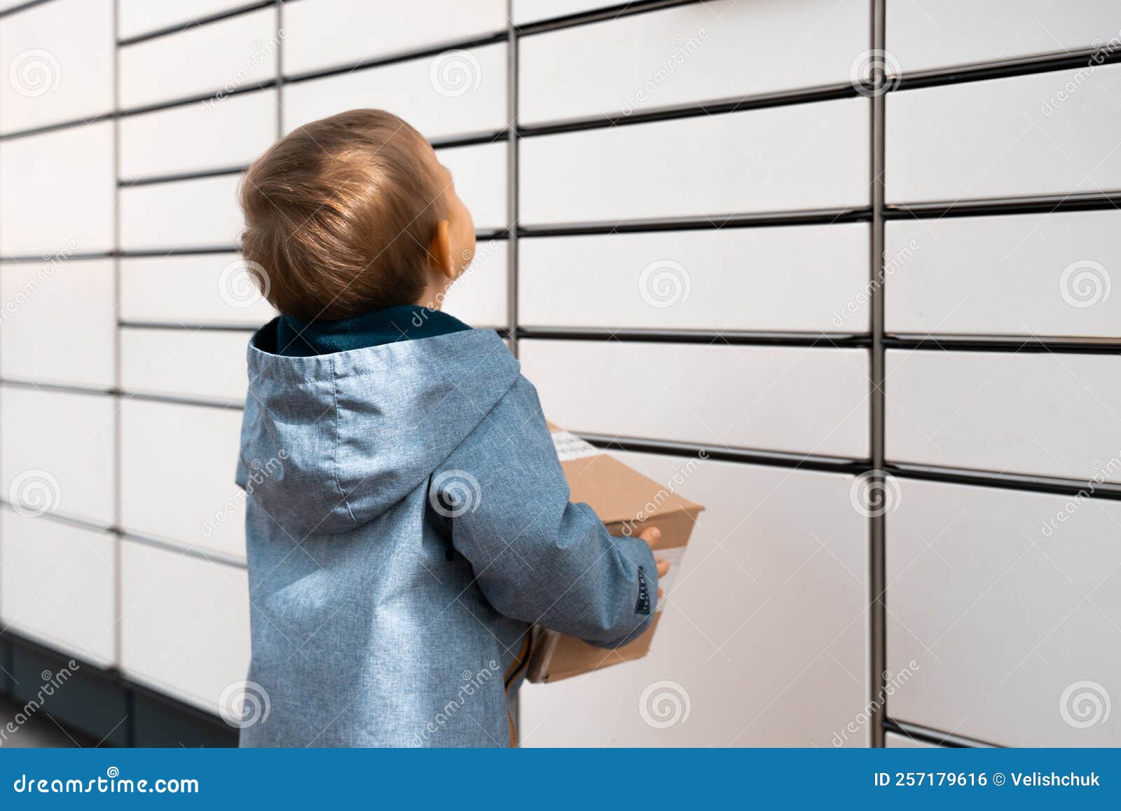Child Parcel, Boy Using Self Service Parcel Terminal Machine To Send or ...