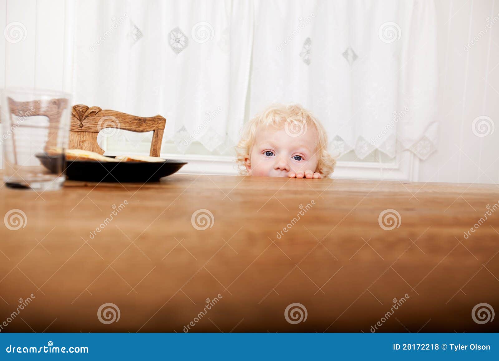 Child Peeking Over Table stock photo. Image of head, home - 20172218