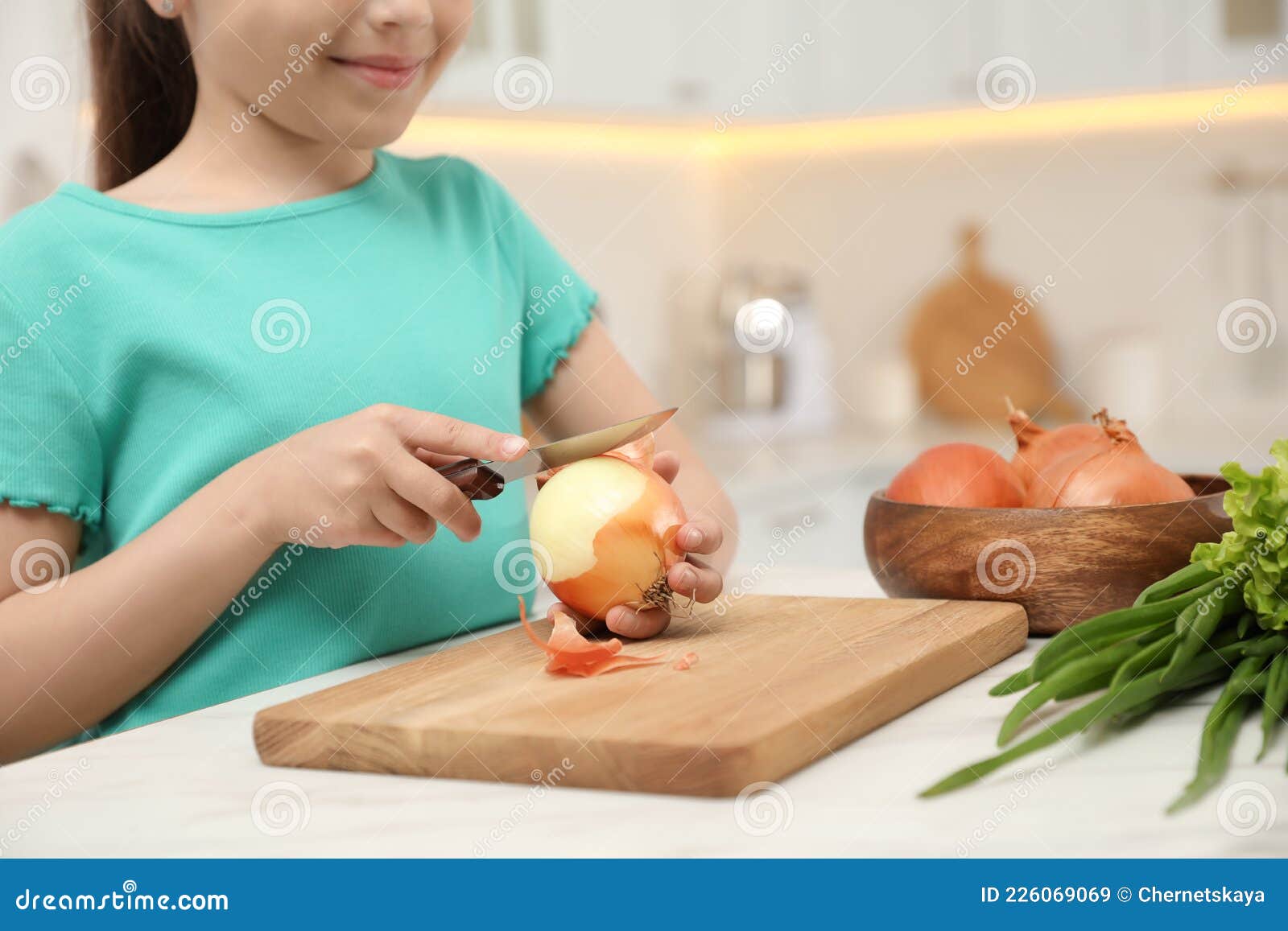 Child Peeling Fresh Vegetable at Table in Kitchen, Closeup Stock Image ...
