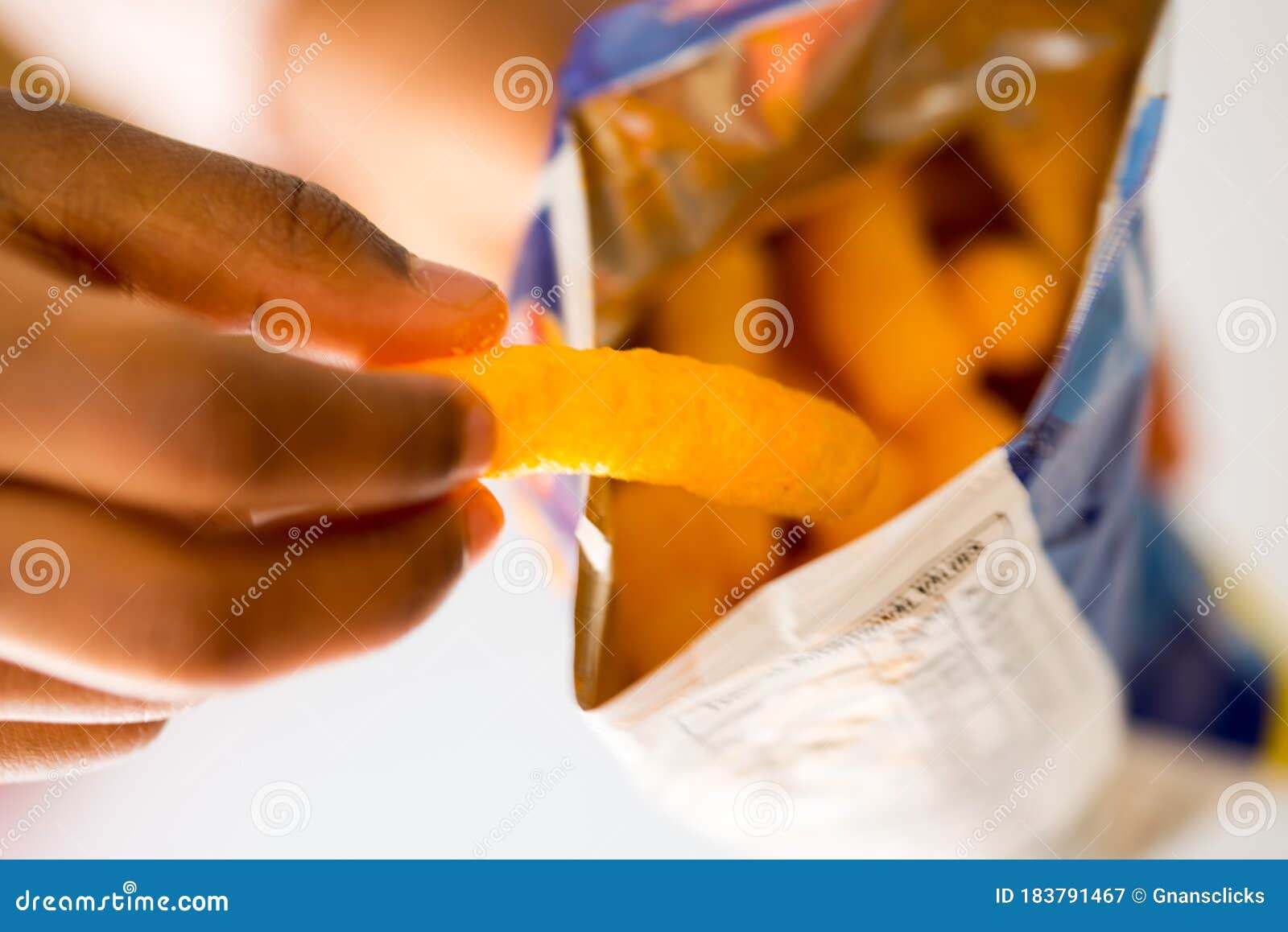 Child Picking Cheese Puffs Snack from Pack Stock Image - Image of ...