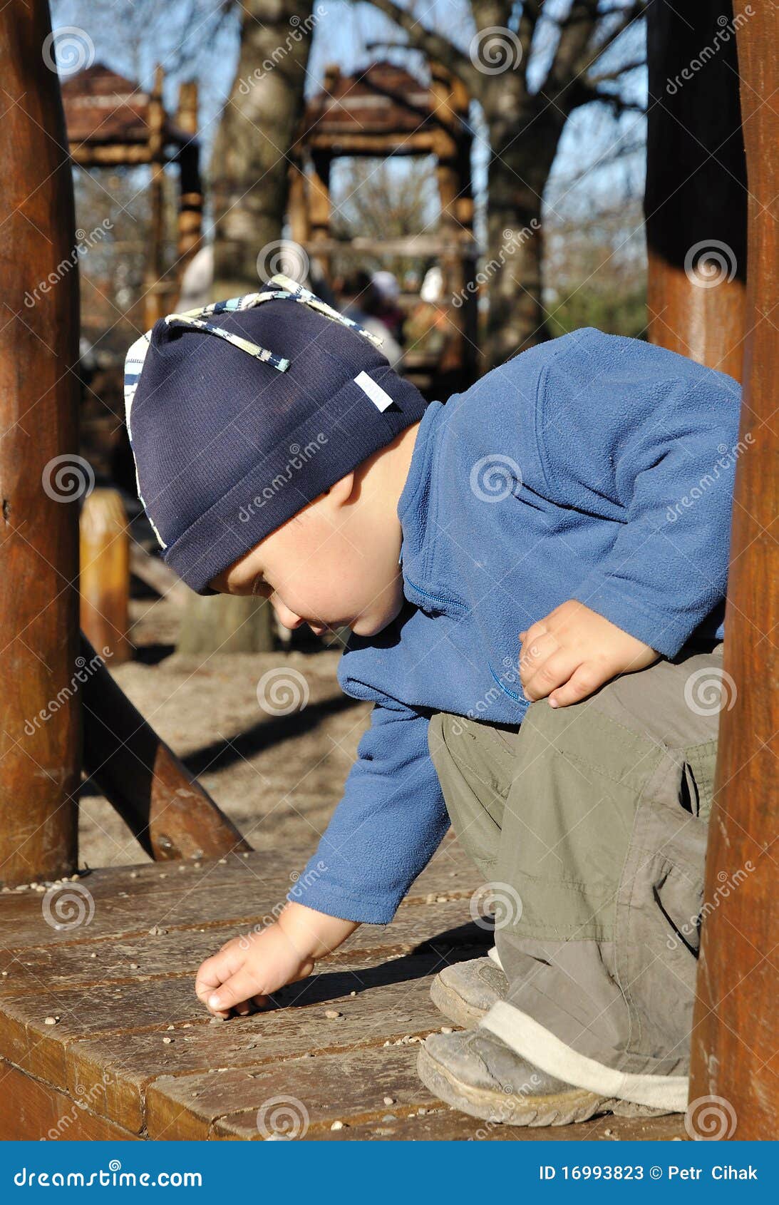 Child picking small stones stock image. Image of grit - 16993823