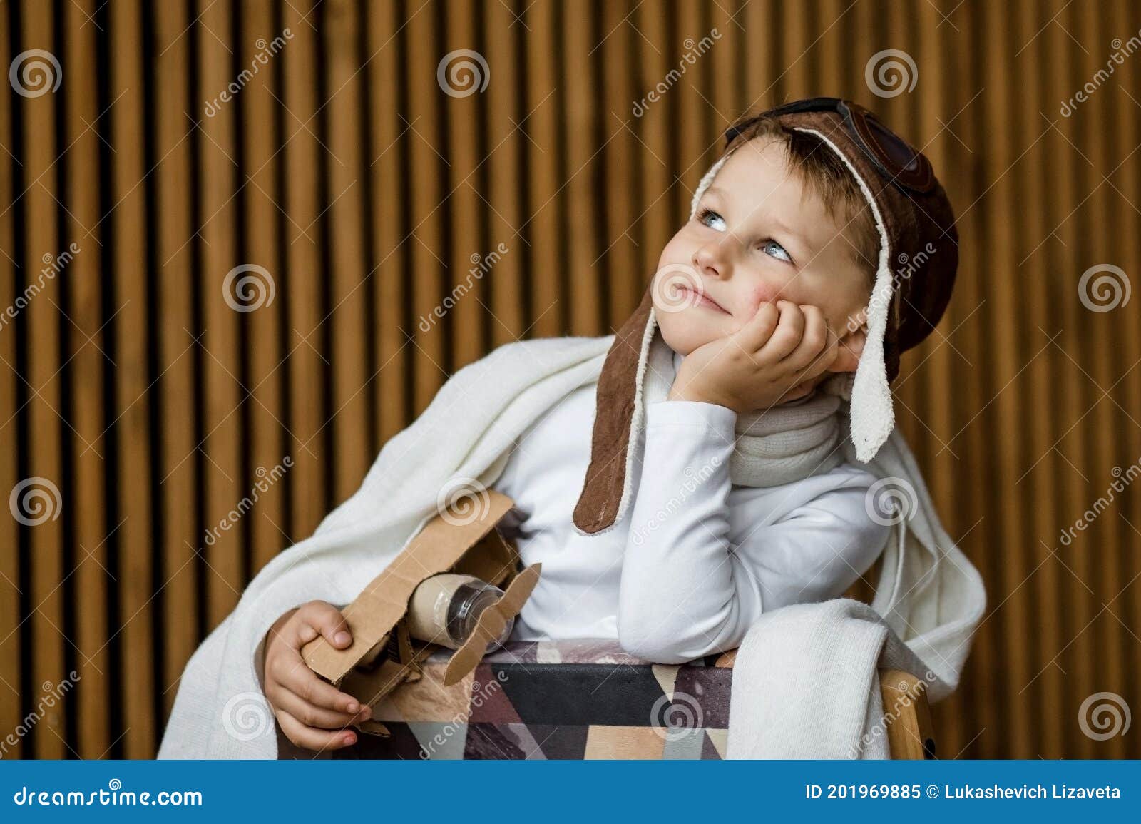 The Child is a Pilot. Dreaming. in an Aviator Suit. Light Coloured ...