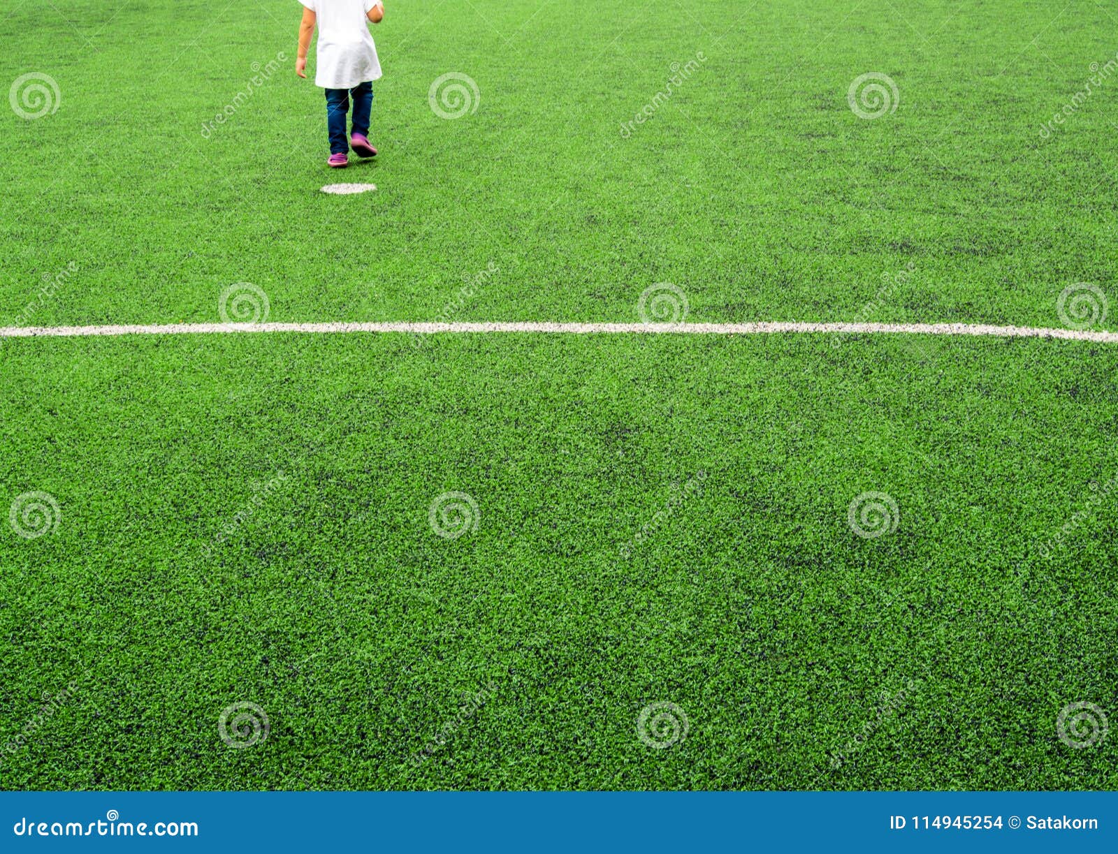 Child Play on the Artificial Turf Stock Photo - Image of pavement ...