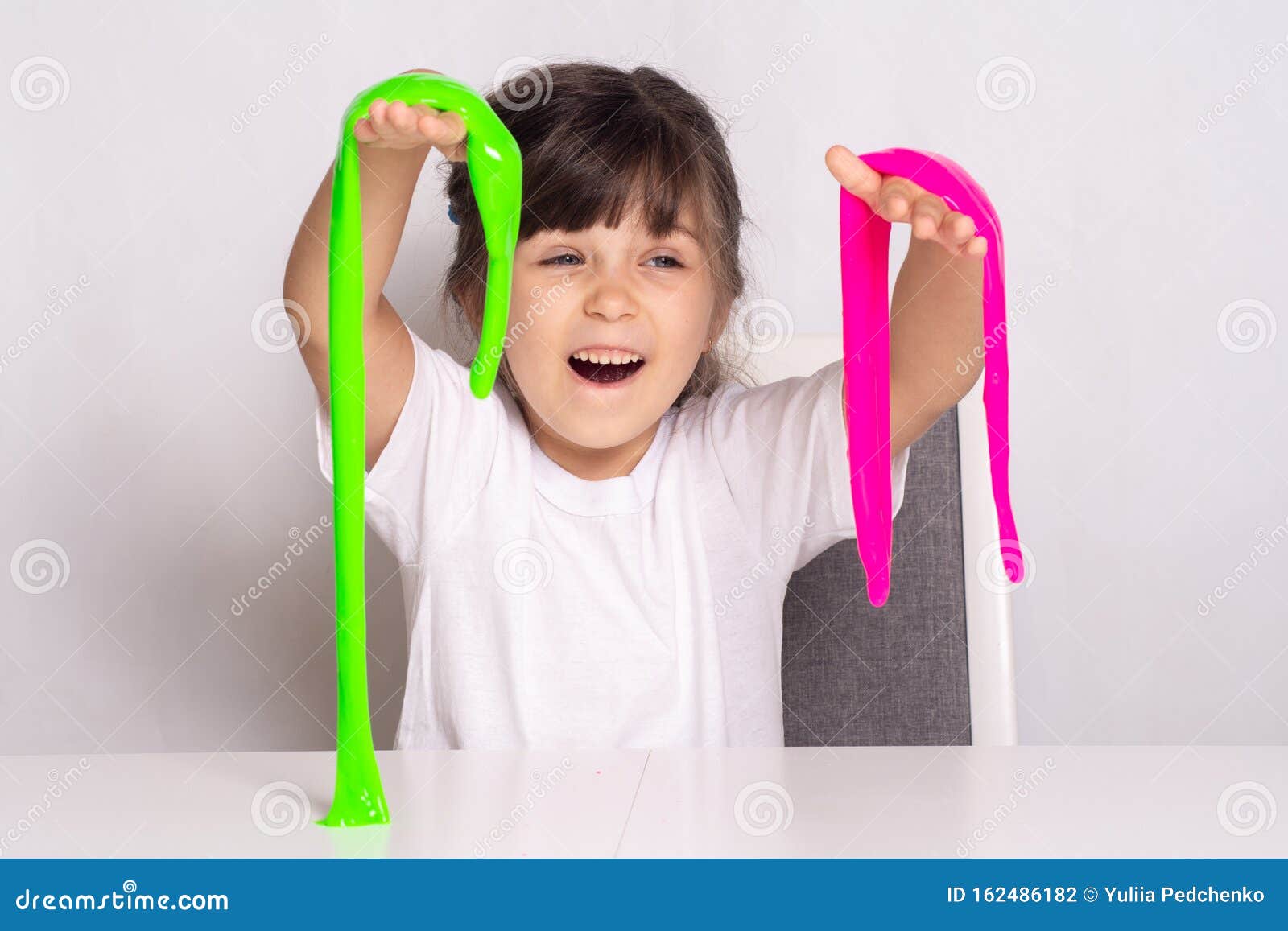 Child Play with Slime. Kid Squeeze and Stretching Slime. Stock Photo ...