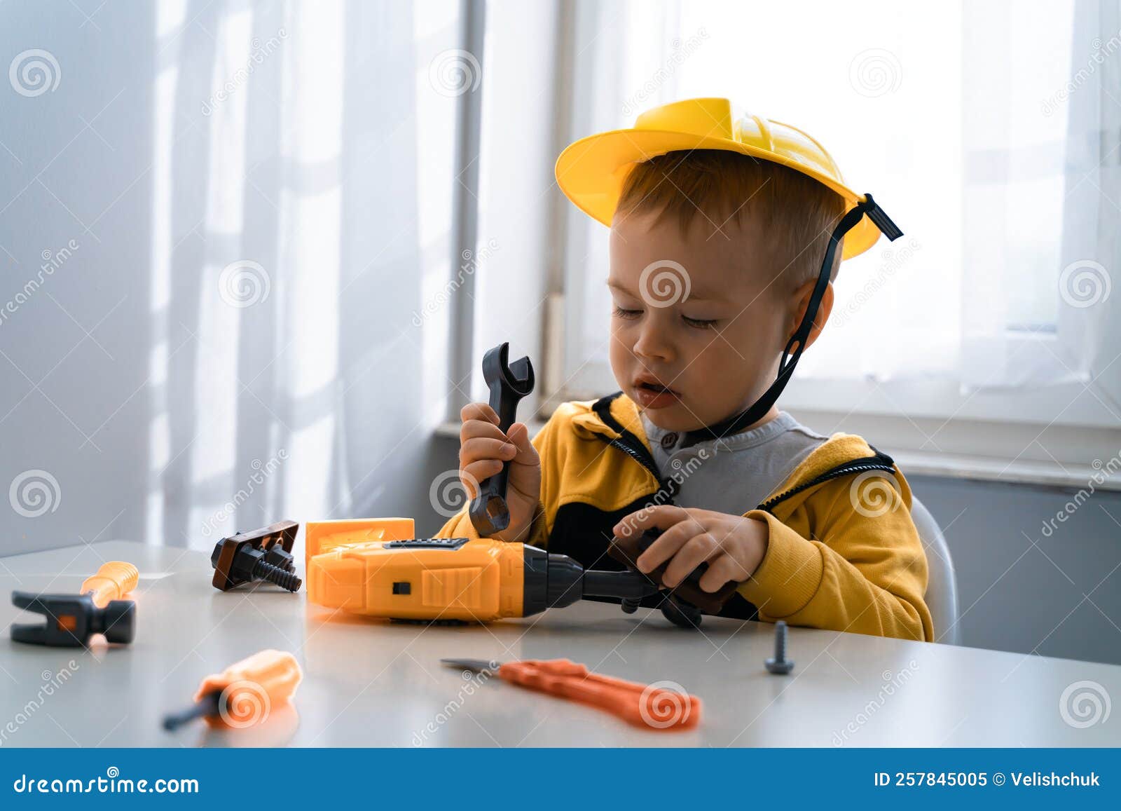 Child Play with Work Tools at Home, Dreams To Be an Engineer. Little ...
