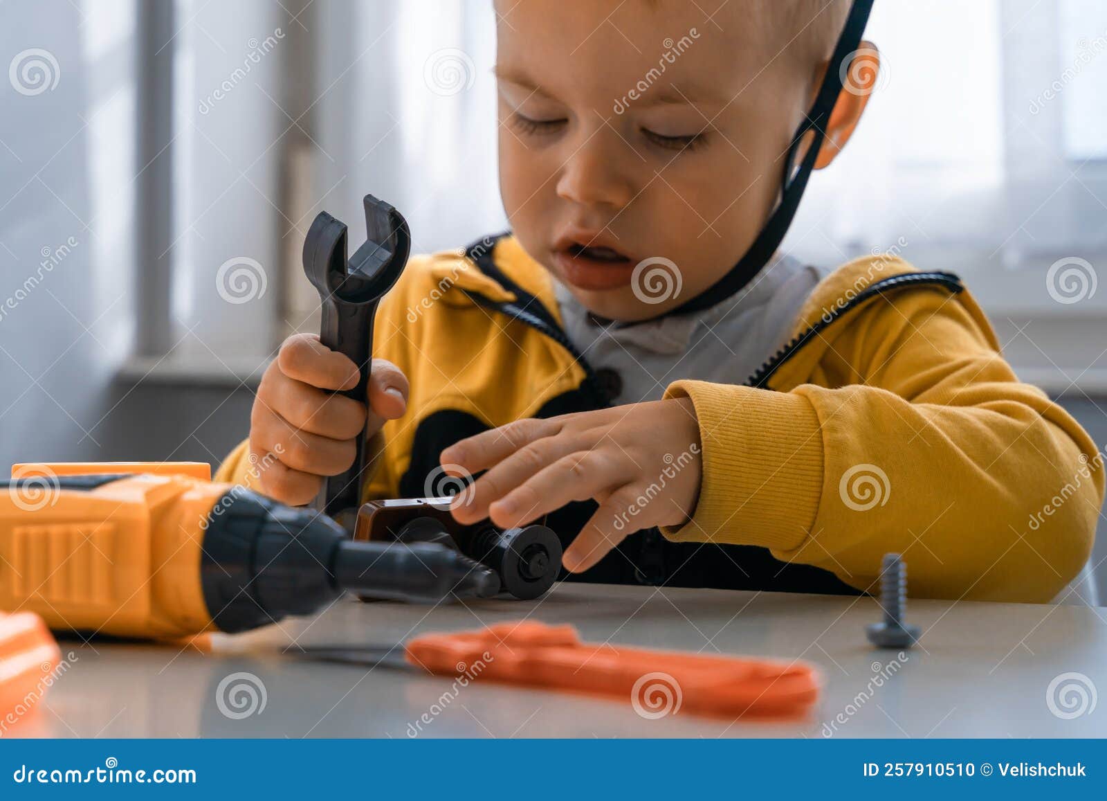 Child Play with Work Tools at Home, Dreams To Be an Engineer. Little ...