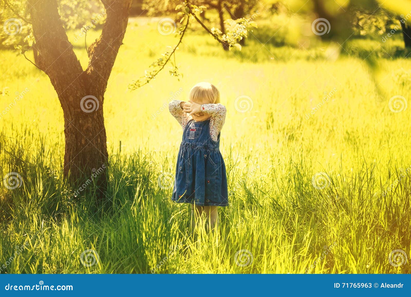 Child Playing Alone in Sunny Garden Stock Image - Image of child ...