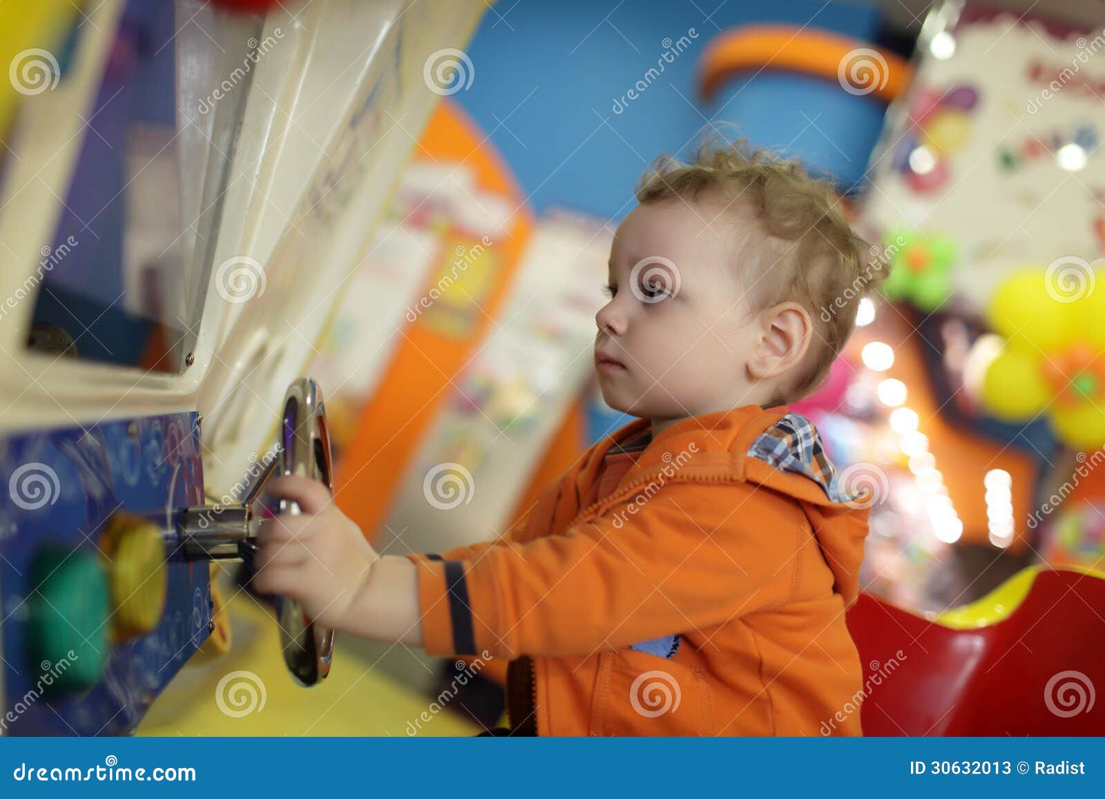 Child Playing with Amusement Machine Stock Image - Image of machine ...