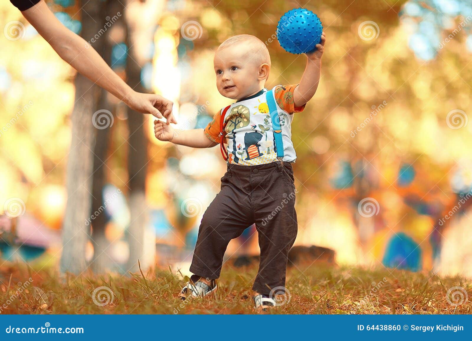 Child Playing with Ball in Park Stock Photo - Image of smile, fall ...