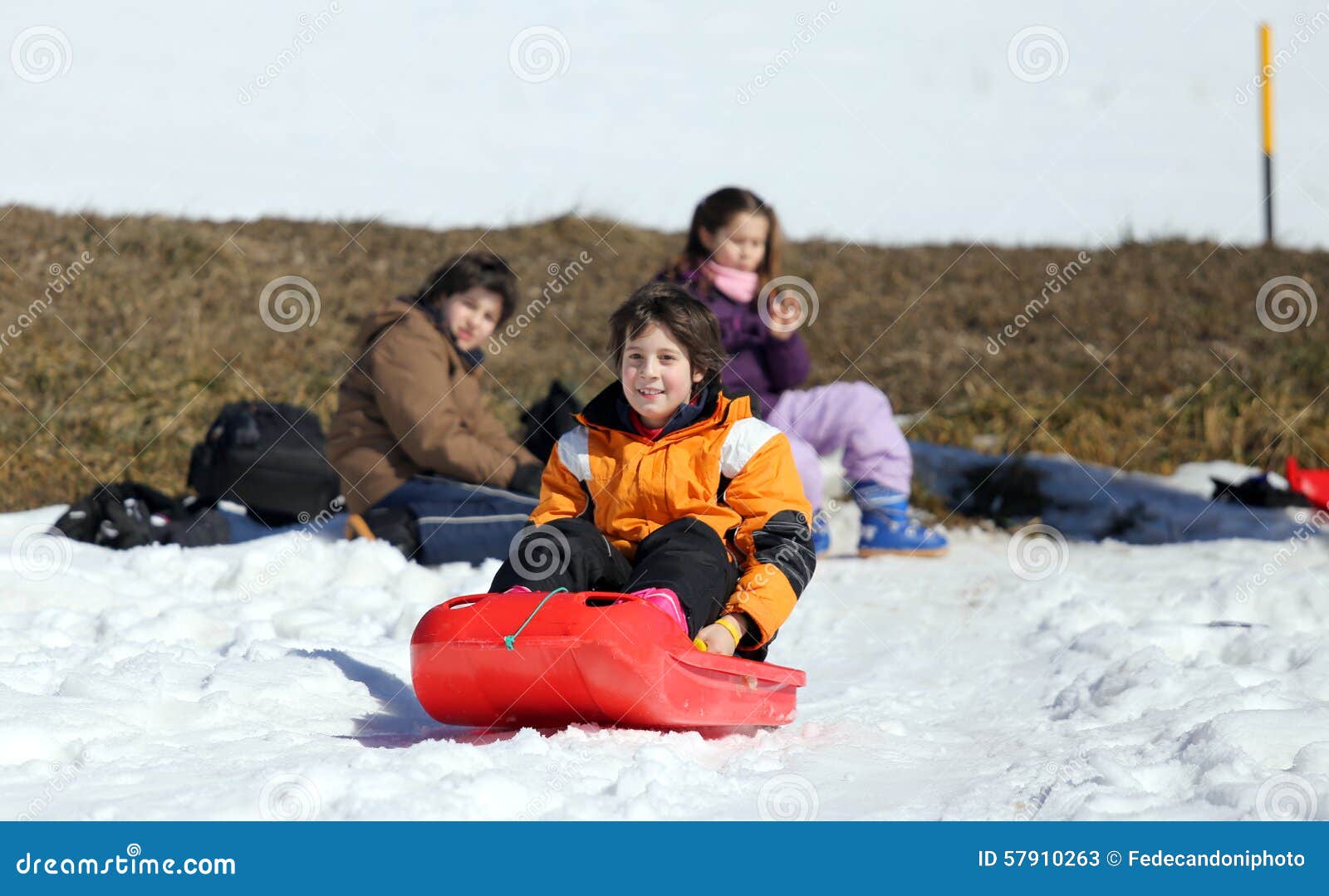 Child Playing with Bob on the Snow in the Mountains Stock Image - Image ...