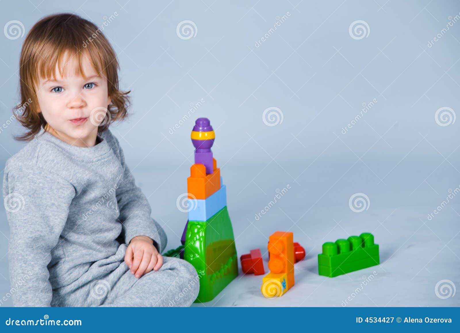 Child playing with bricks stock image. Image of color - 4534427