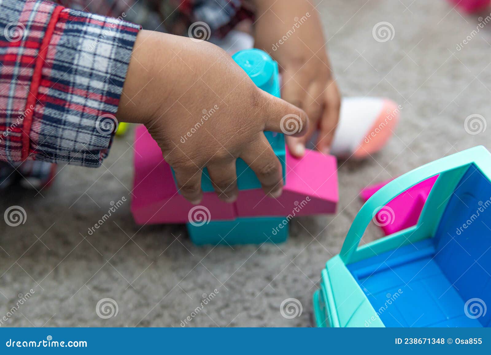 Child Playing with Bricks at Home To Construct a Toy Stock Photo ...