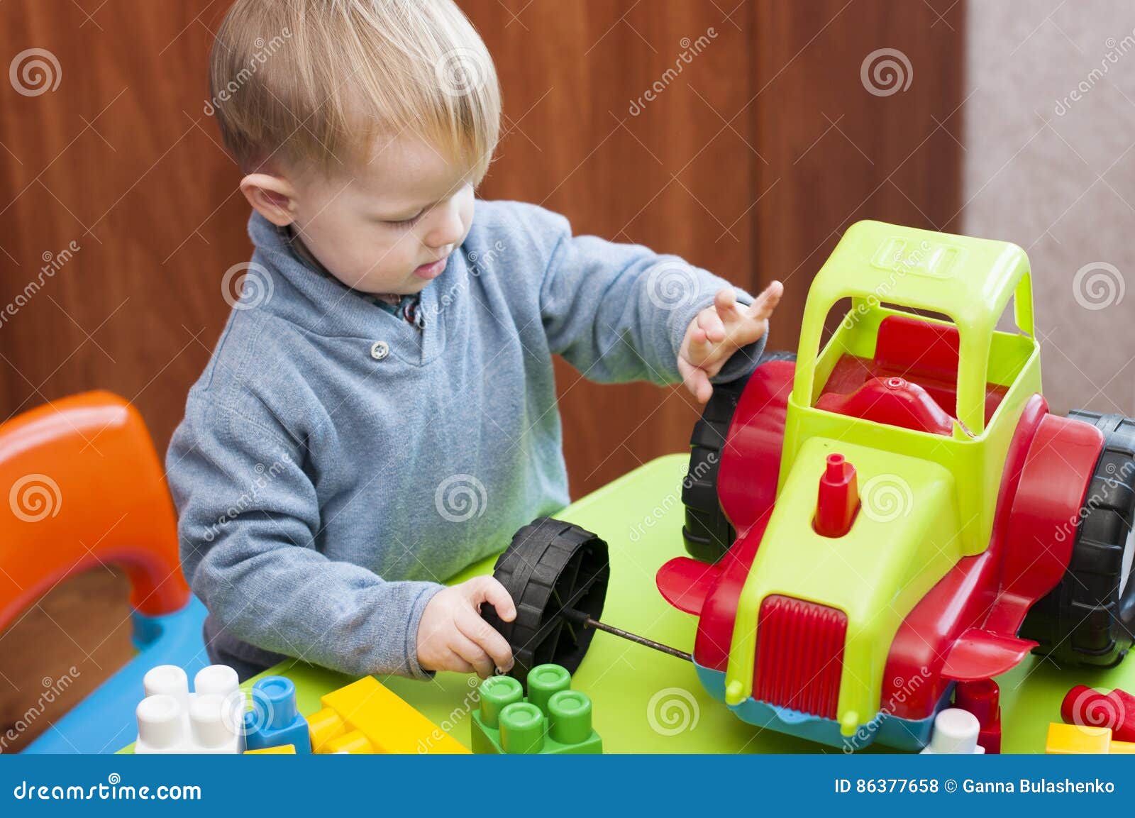 A Child Playing with a Broken Stock Photo - Image of auto, small: 86377658