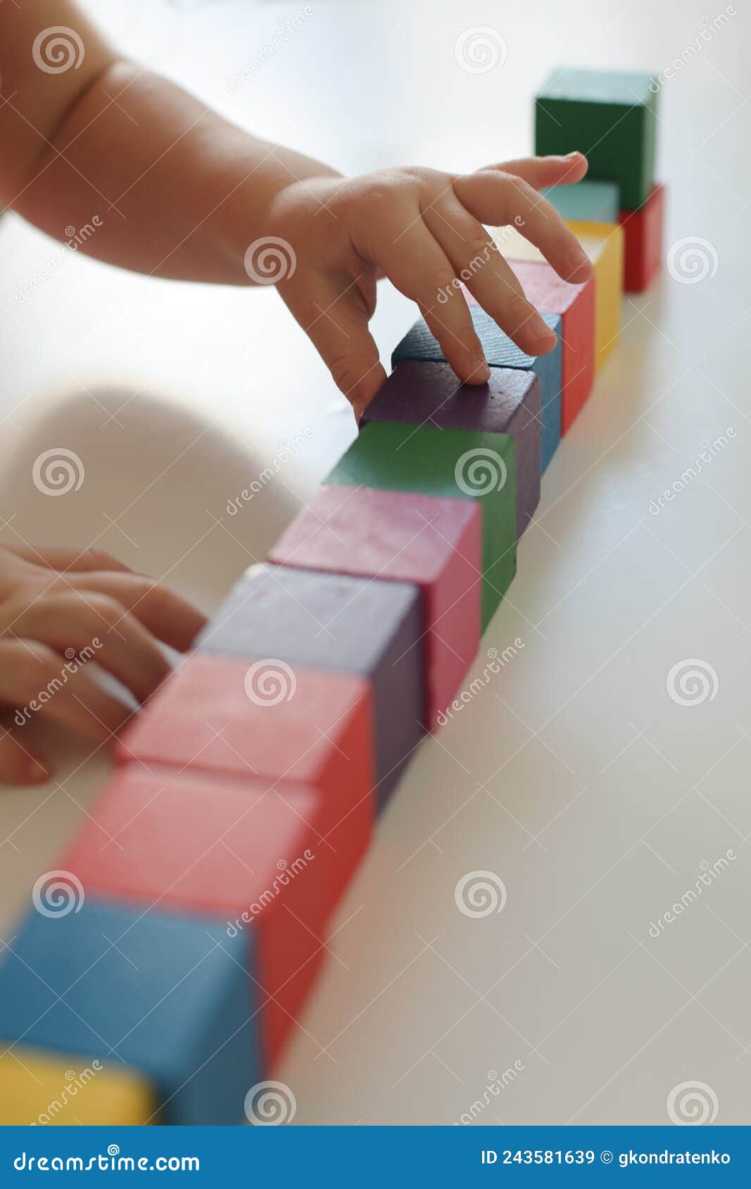 Child Playing and Building with Colorful Wooden Toy Bricks on White ...