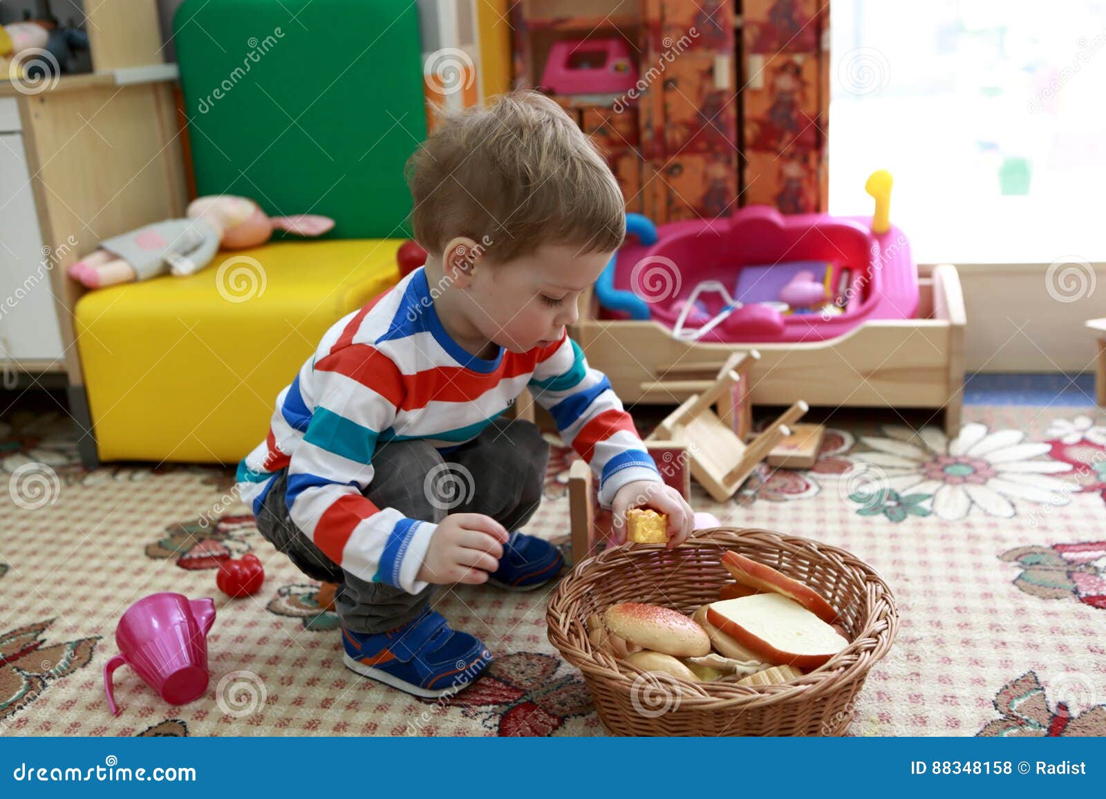 Child playing on carpet stock photo. Image of cheerful - 88348158